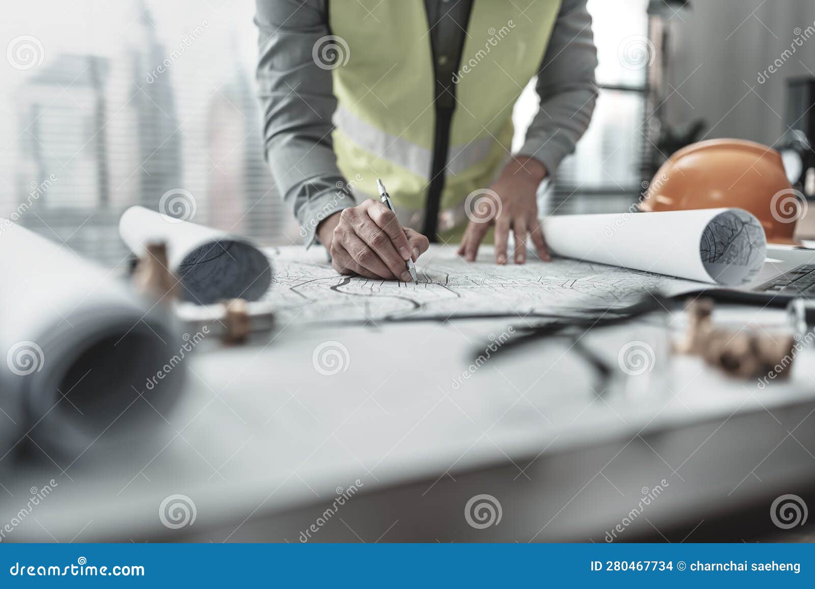 Architect, Engineer Planning and Drawing on City Map and Marking a ...