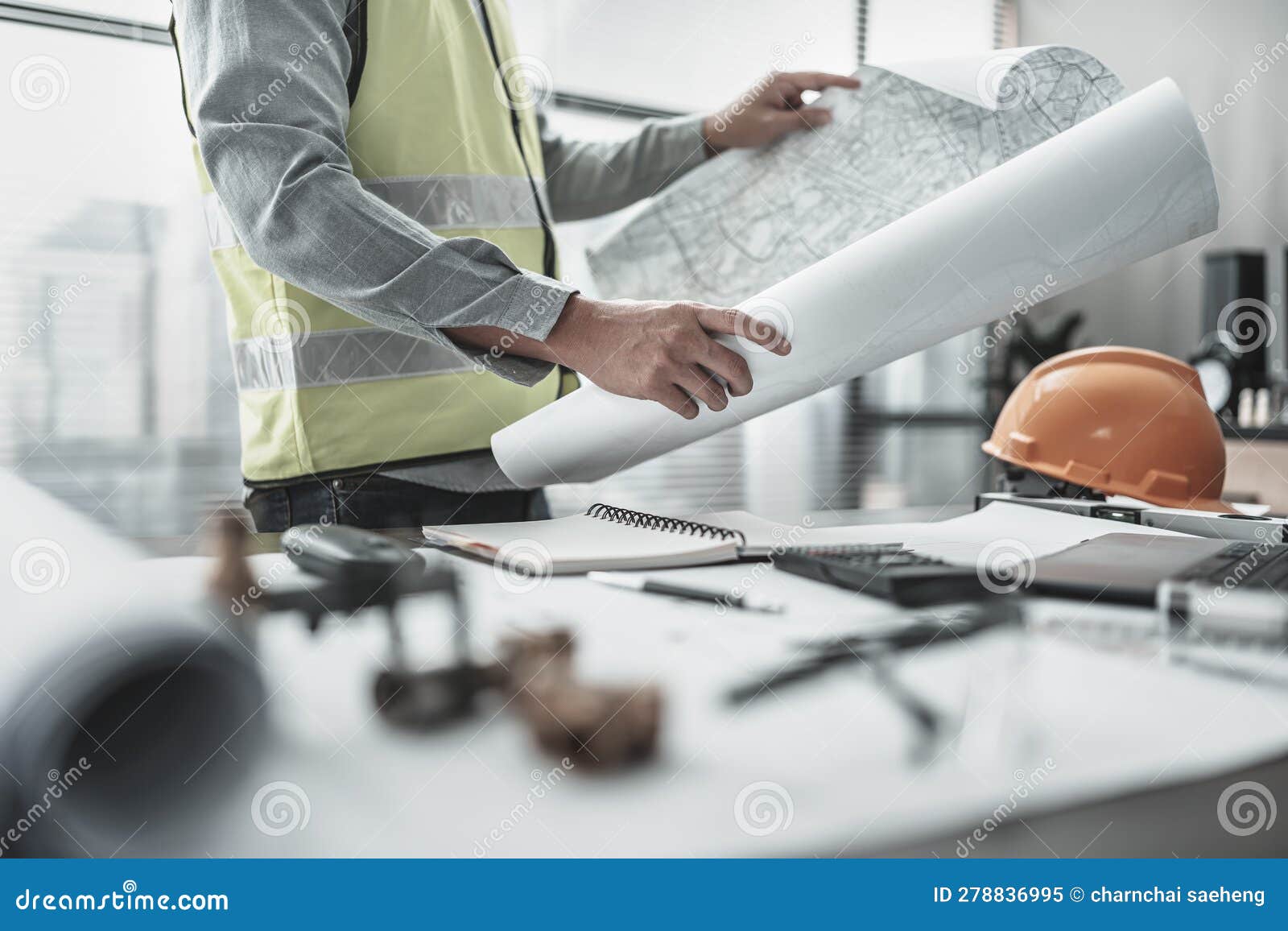 Architect, Engineer Planning and Reading on City Map and Marking a ...