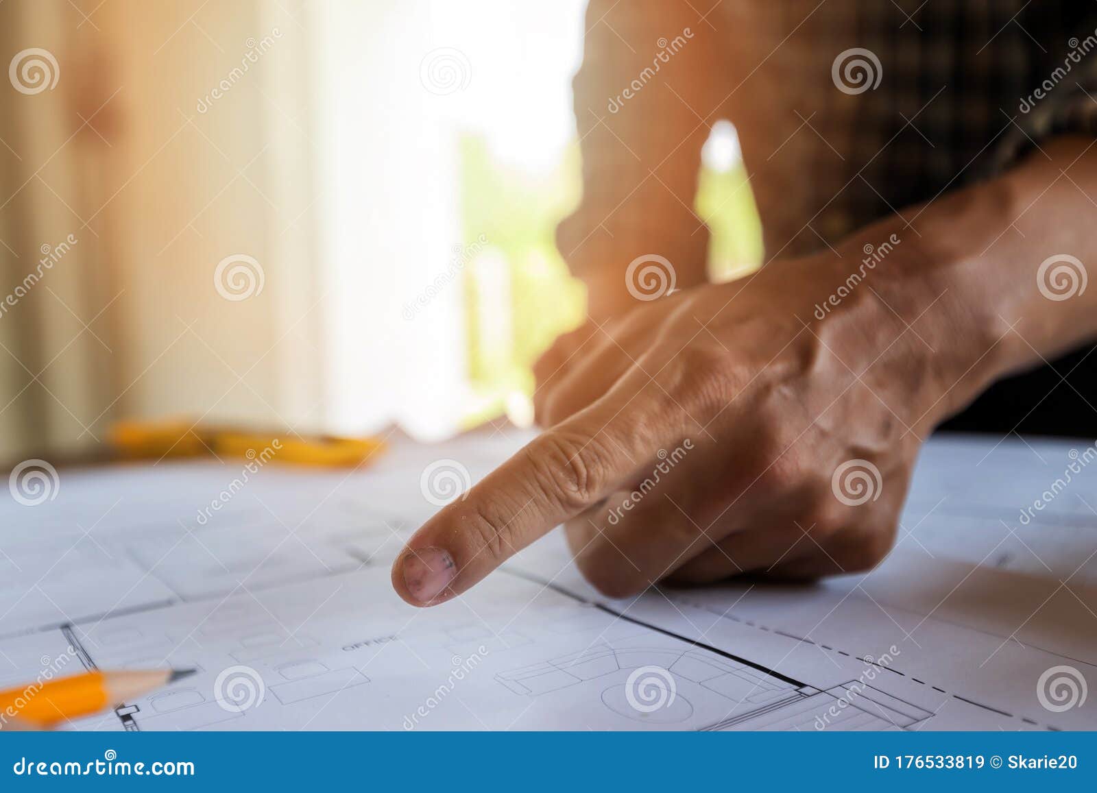 An Architect or Engineer Pointing on Blueprint, Architectural Concept ...