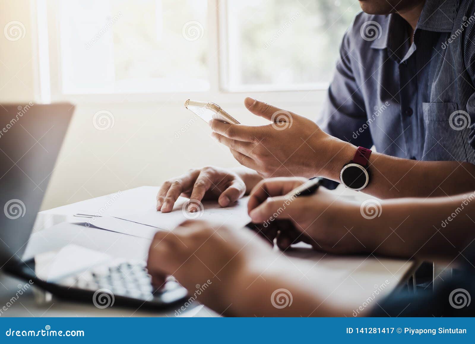 Architect or Engineer Reading Message on Phone during the Meeting ...