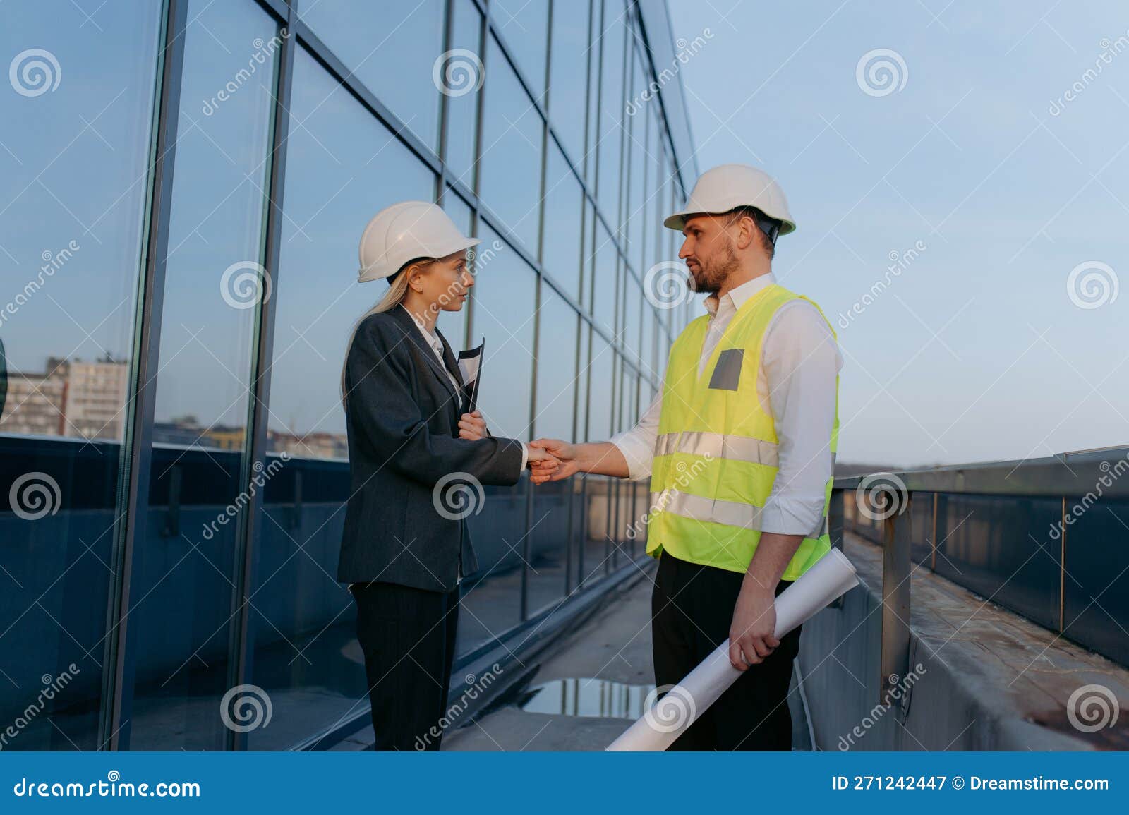 An Architect and an Engineer Shake Hands on the Terrace of a Built ...