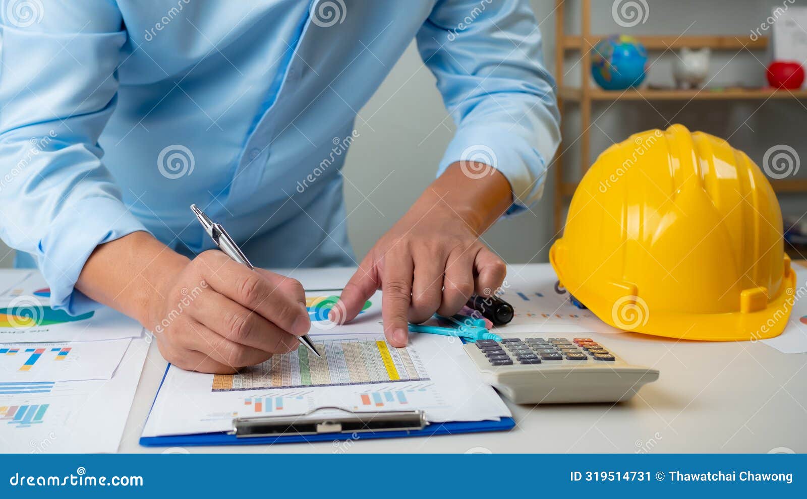 Architect or Engineer Sitting at Desk in Office, Cost Calculation ...