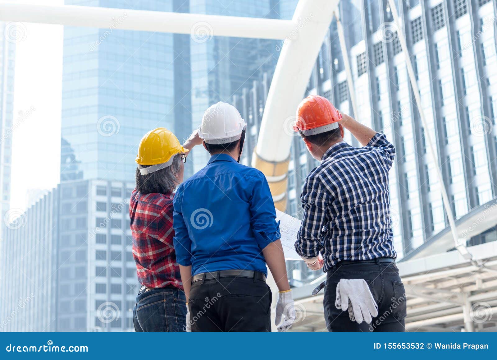 Architect Engineer Team Planning Blue Print in Construction City Site ...