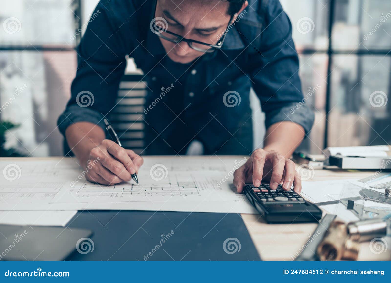 Architect Engineer Use Calculator for Calculate Drawing Design Working ...