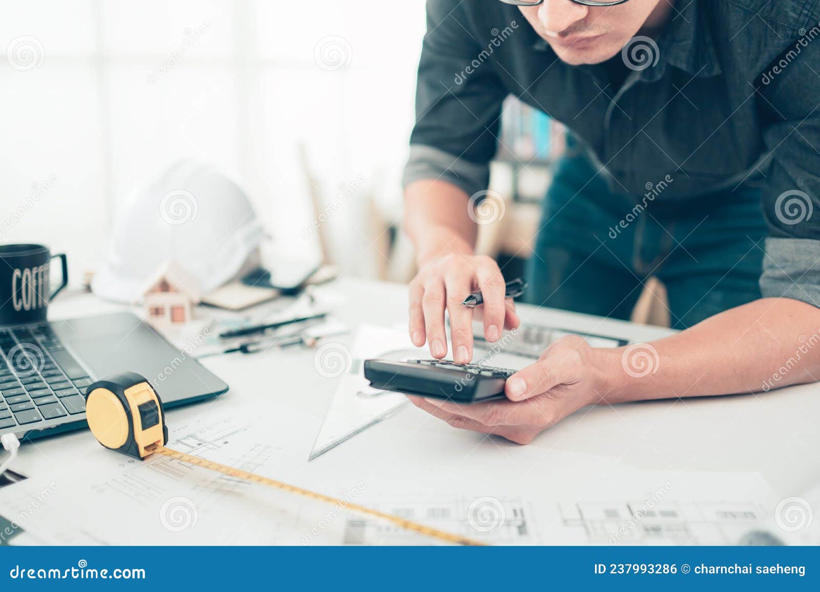 Architect Engineer Use Calculator for Calculate Drawing Design Working ...