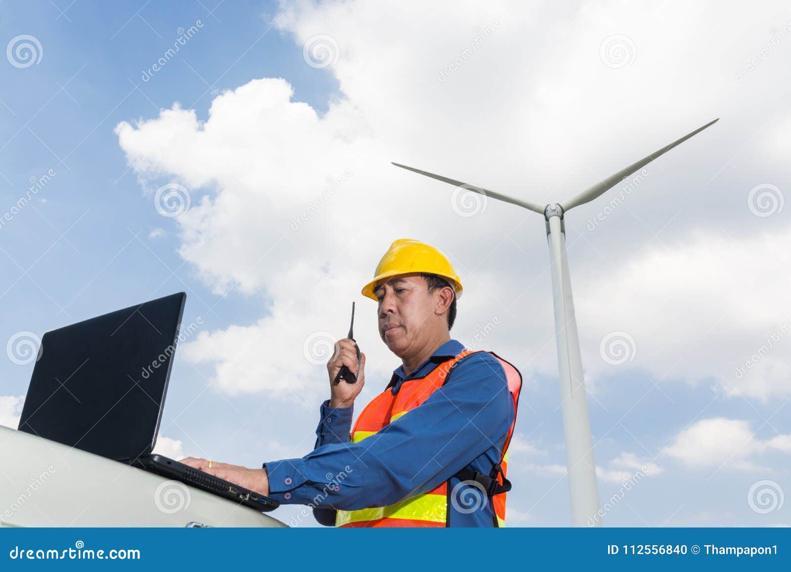 Architect or Engineer Use Laptop Computer and Transceiver Handheld ...