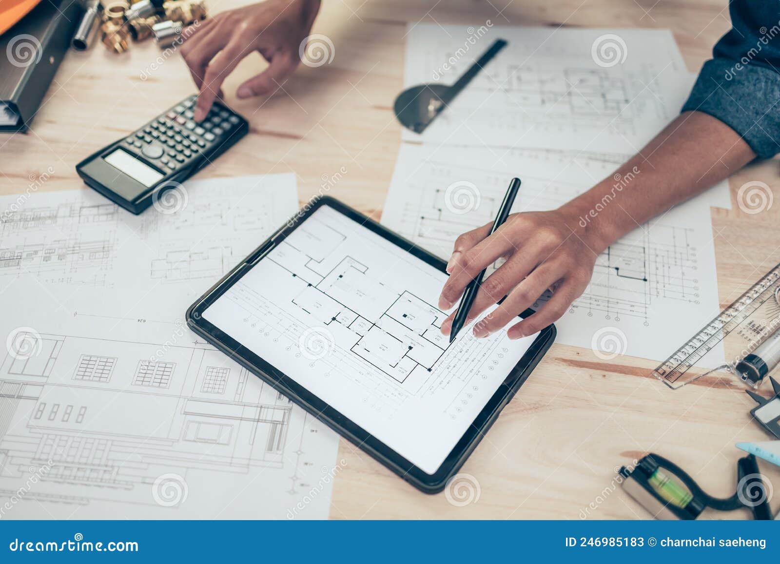 Architect Engineer Use Tablet To Read Drawing Design. House Planning ...