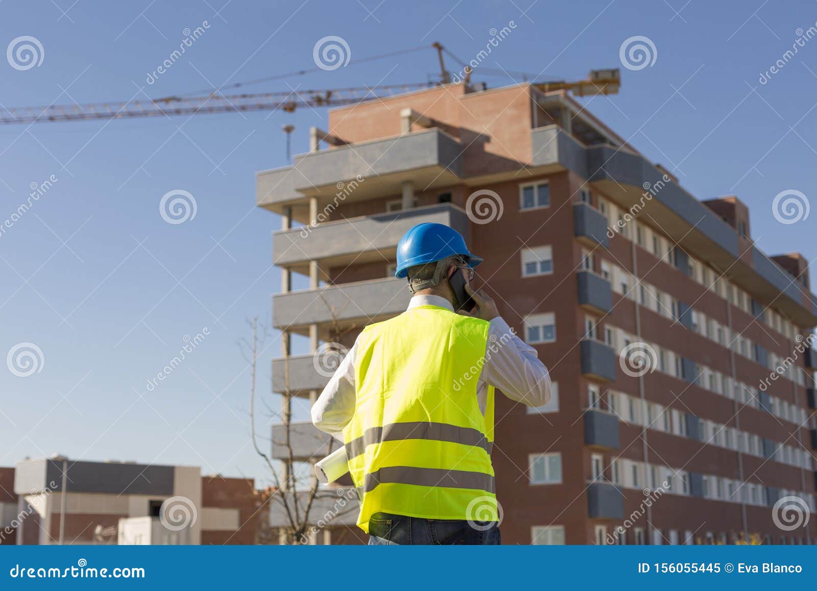 Architect or Engineer Using Cell Phone on the Construction Site Stock ...