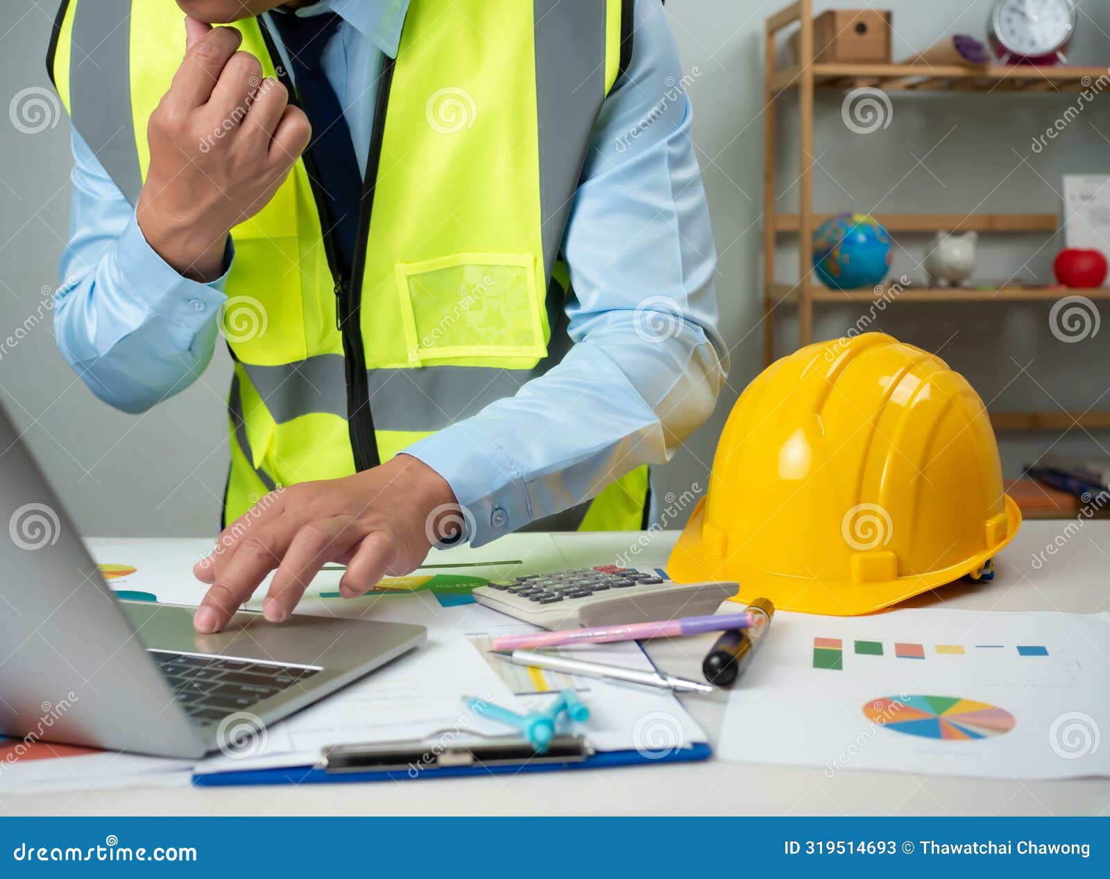 Architect or Engineer Using Computer To Work on Desk, Cost Calculation ...