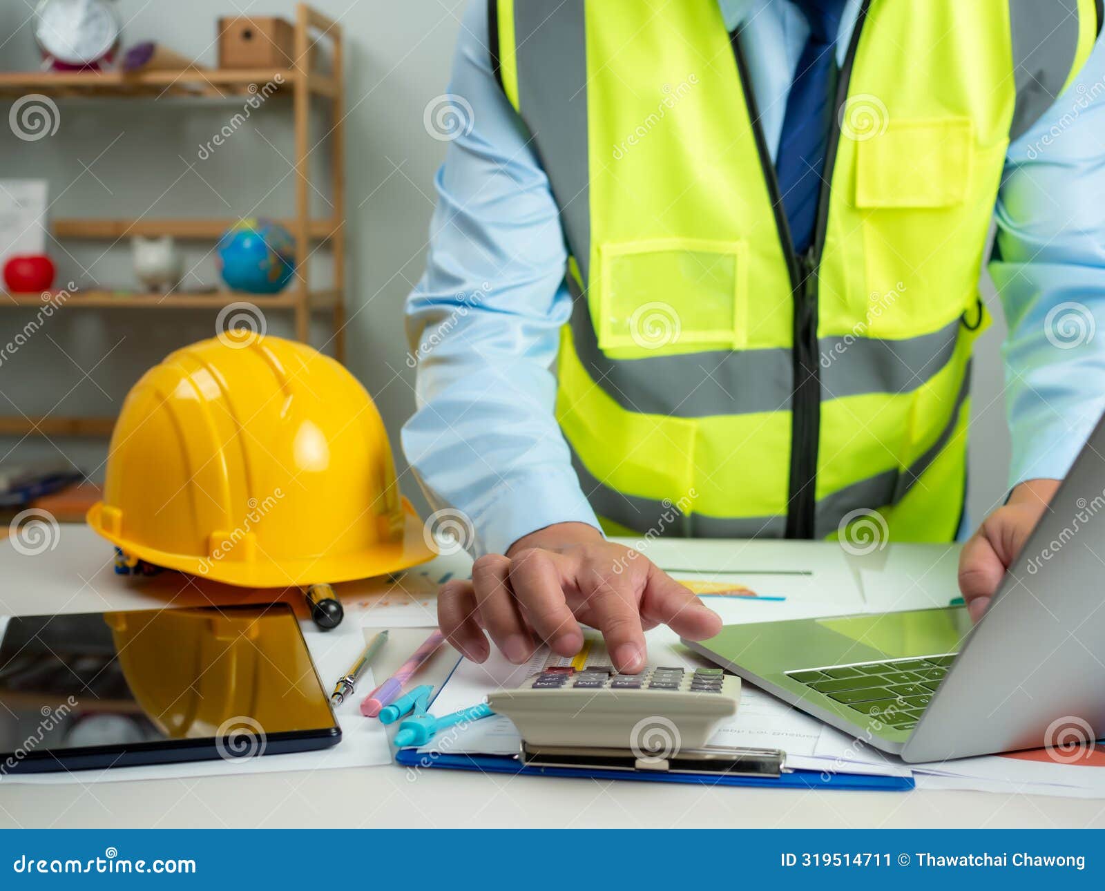 Architect or Engineer Using Computer To Work on Desk, Cost Calculation ...