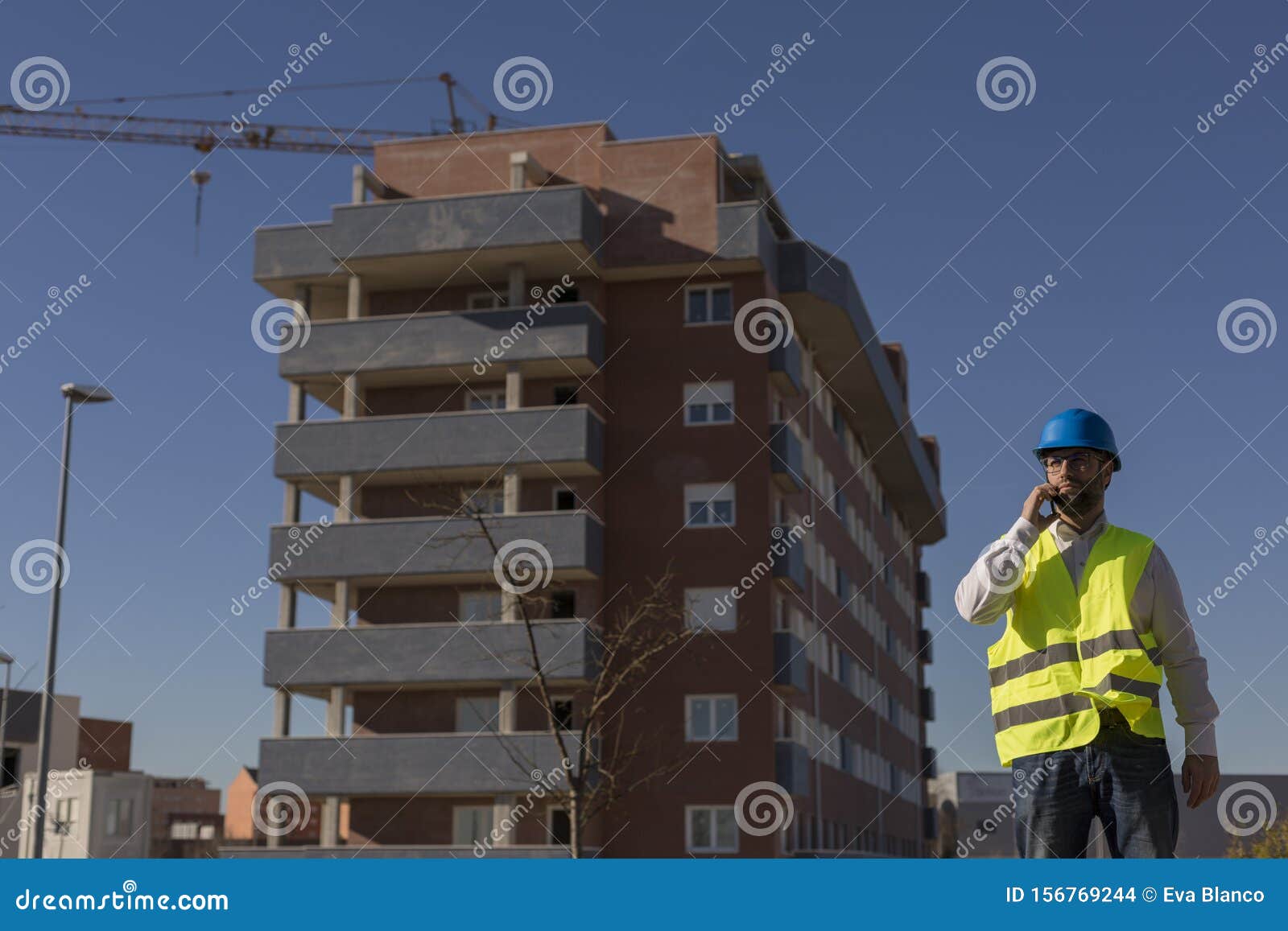 Architect or Engineer Using Mobile Phone on the Construction Site ...