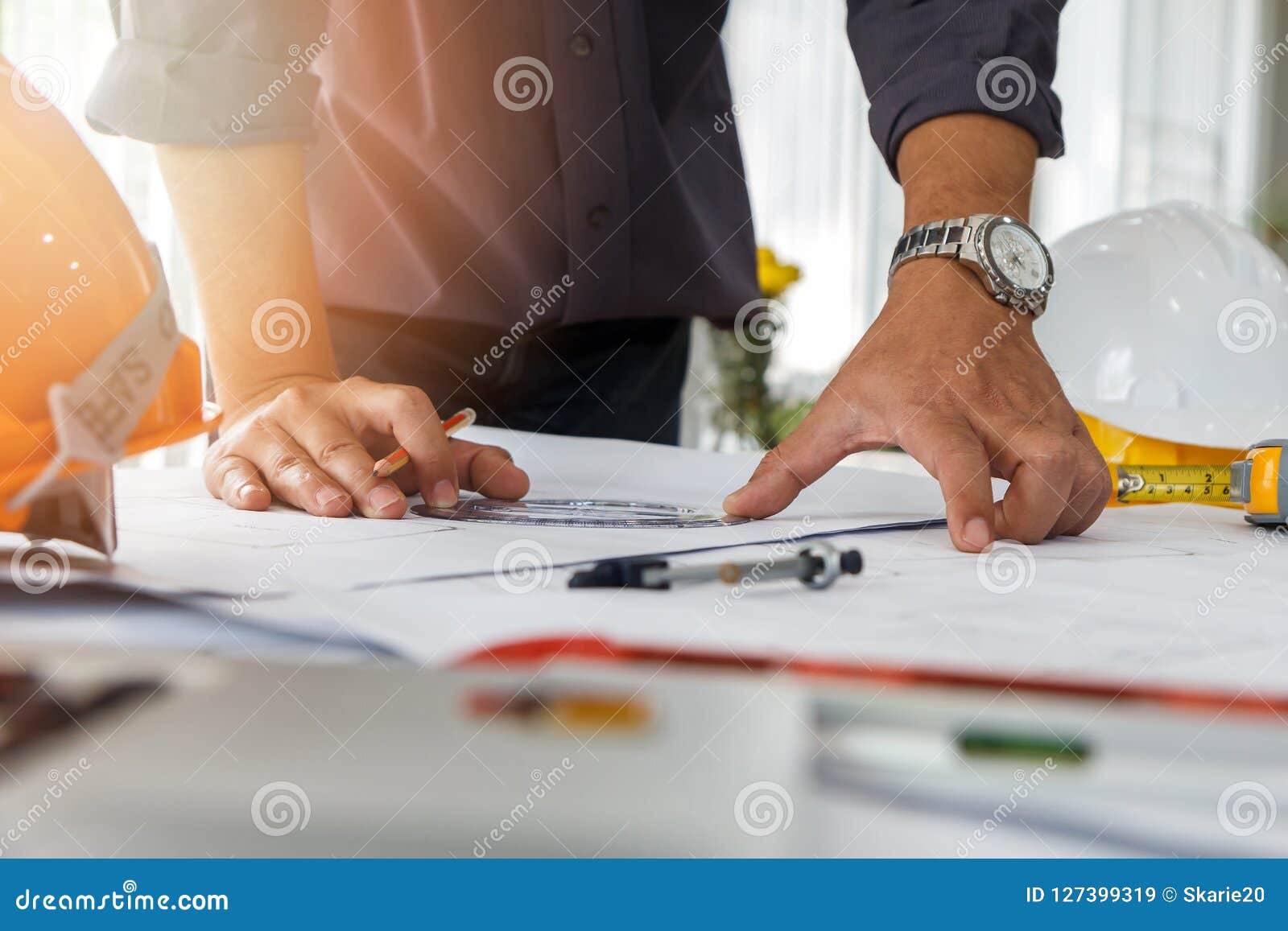 Architect or Engineer Using Pencil and Protractor Working on Blueprint ...