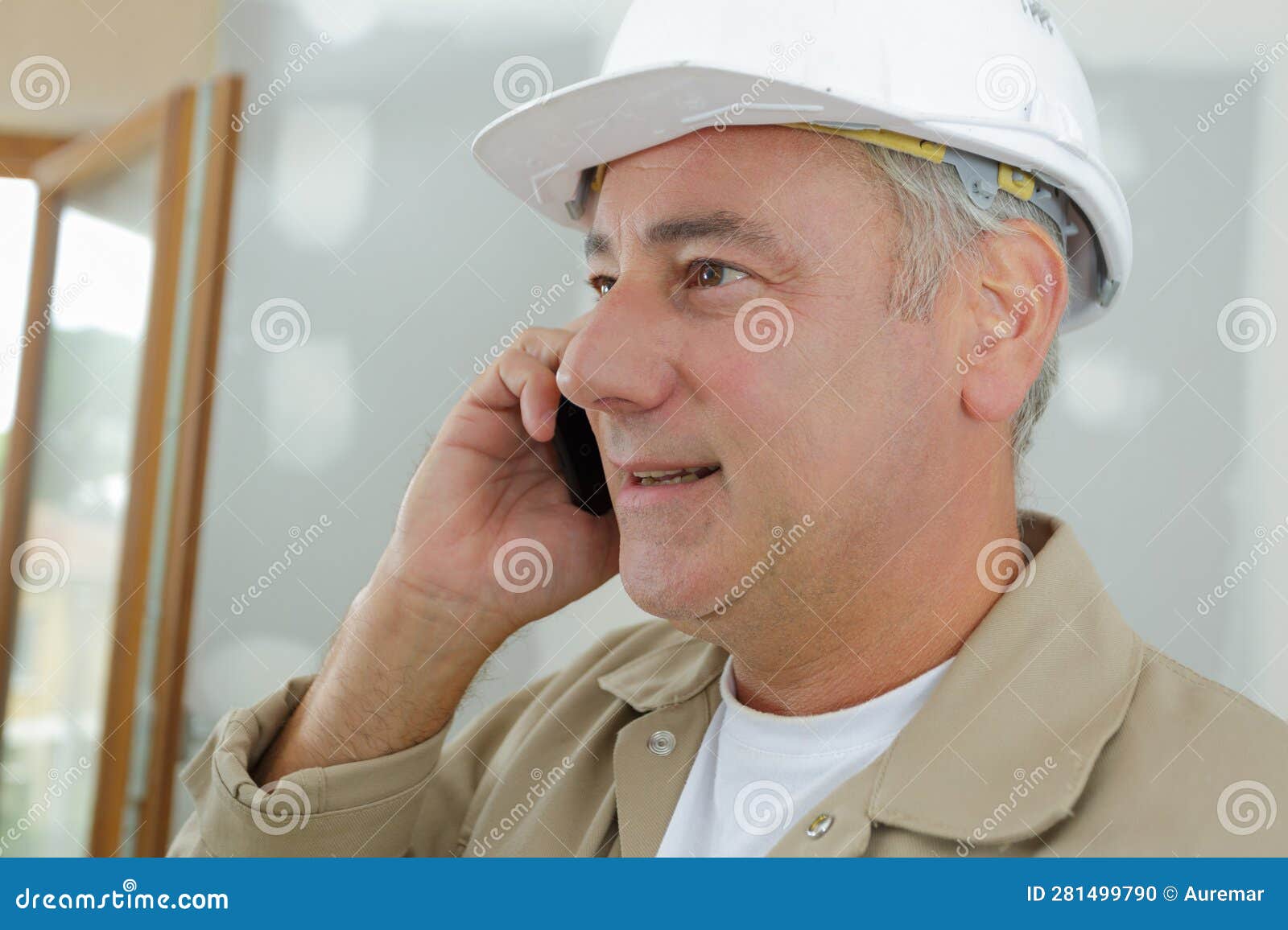 Architect or Engineer Using Phone in Construction Site Stock Photo ...