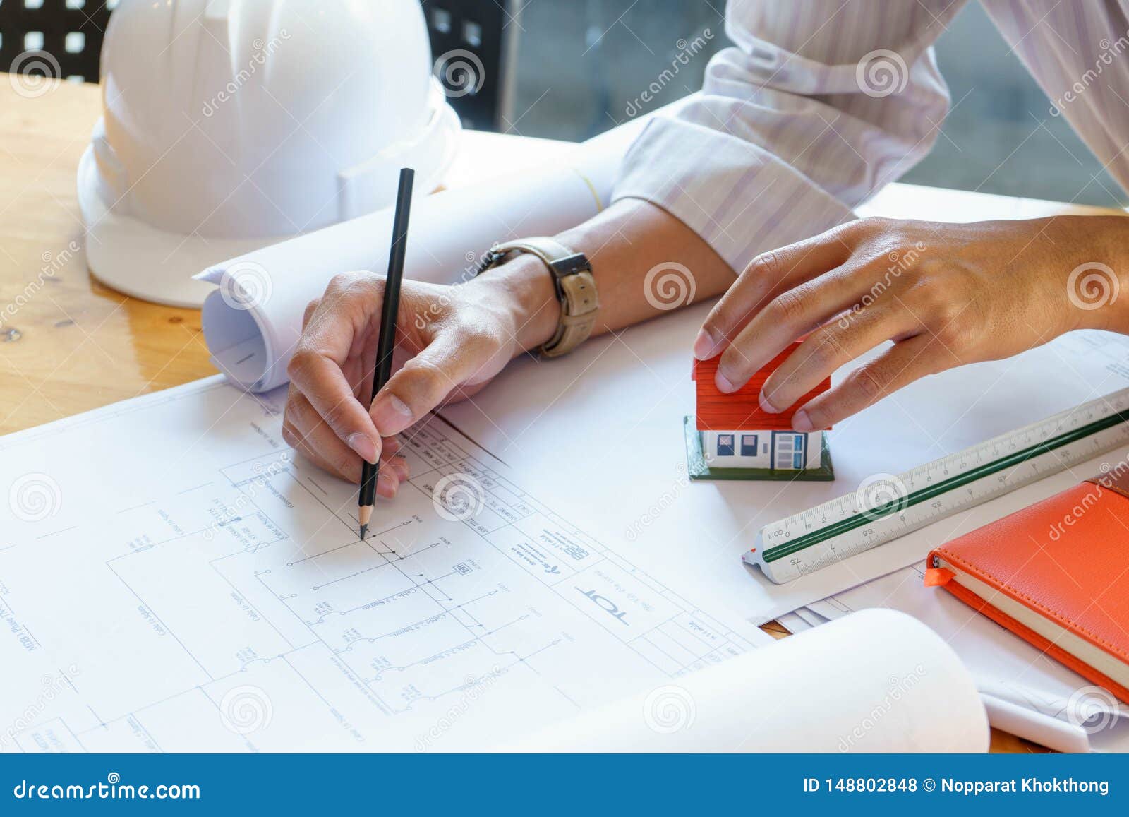 Architect or Engineer Working on Blueprint at Workplace on Wooden Desk ...