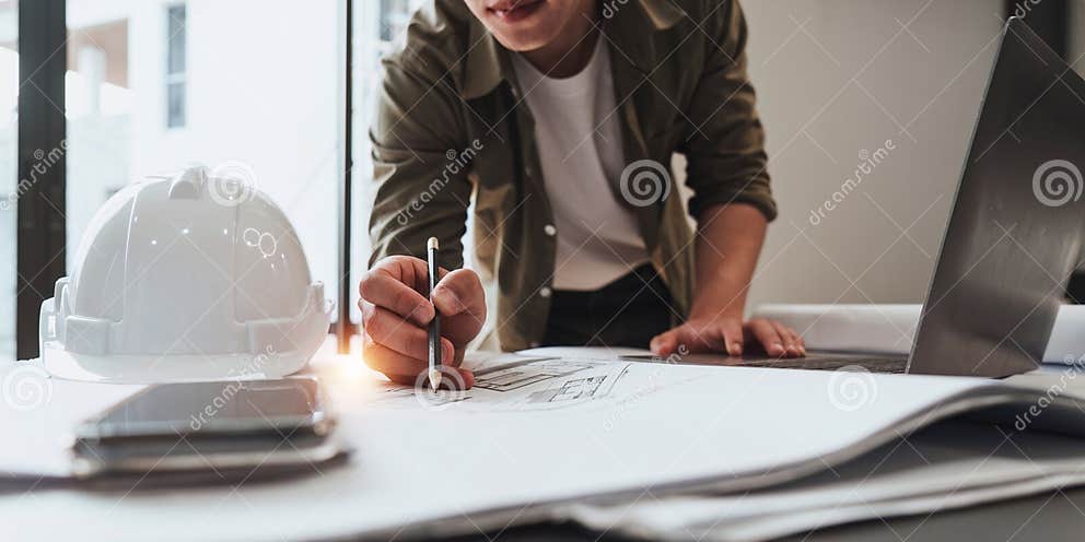 Architect or Engineer Working with Blueprints for Architectural Plan ...