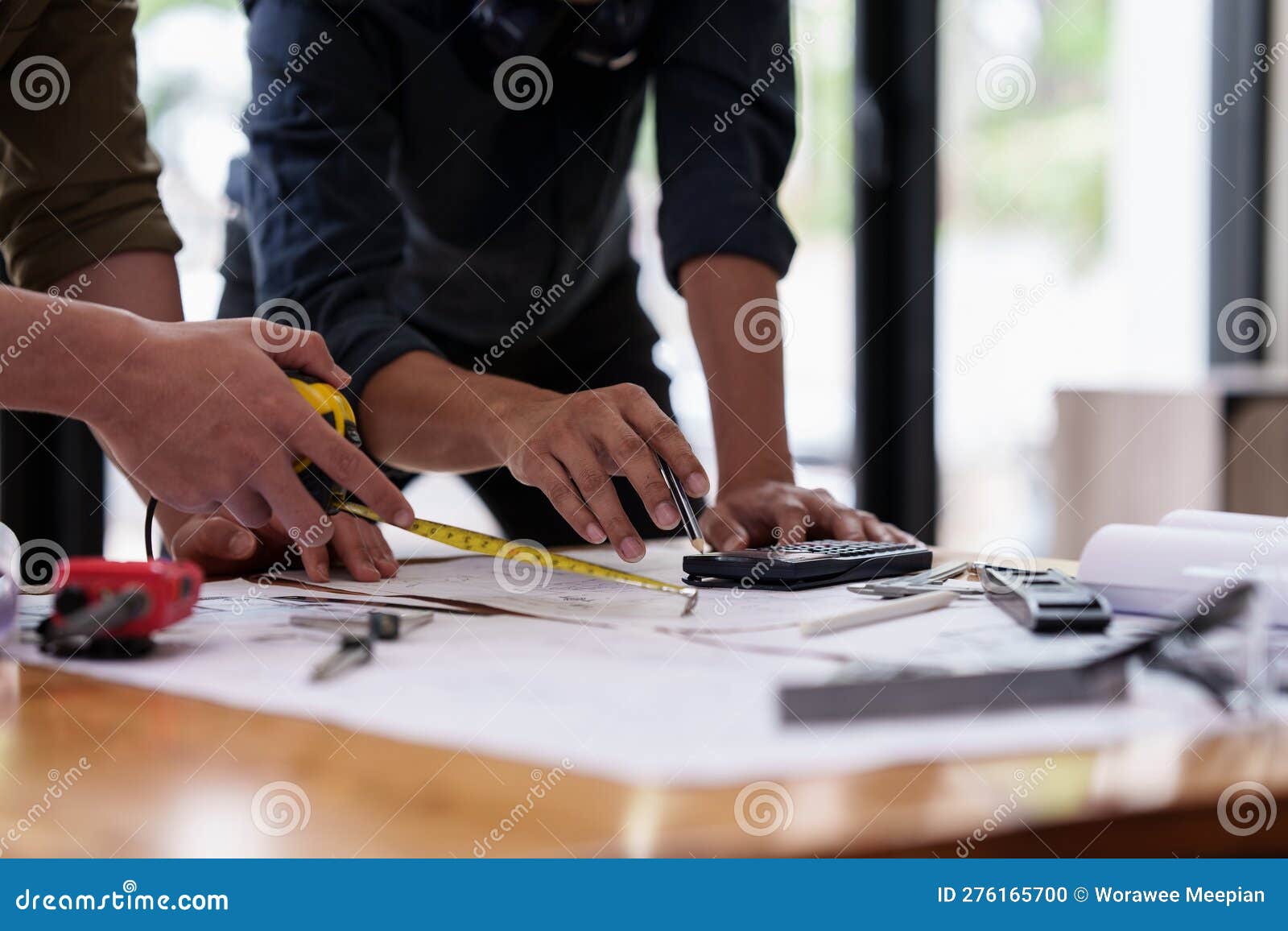 Architect and Engineer Working with Blueprints for Architectural Plan ...