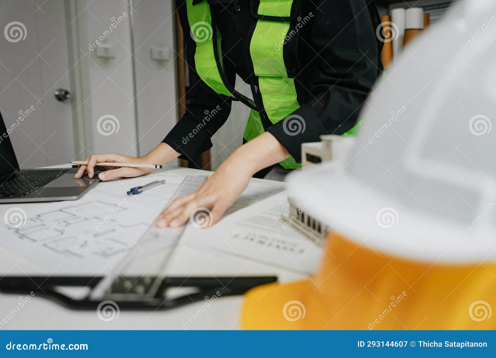 Architect or Engineer Working on Table Use Drawing Tool on the Paper ...