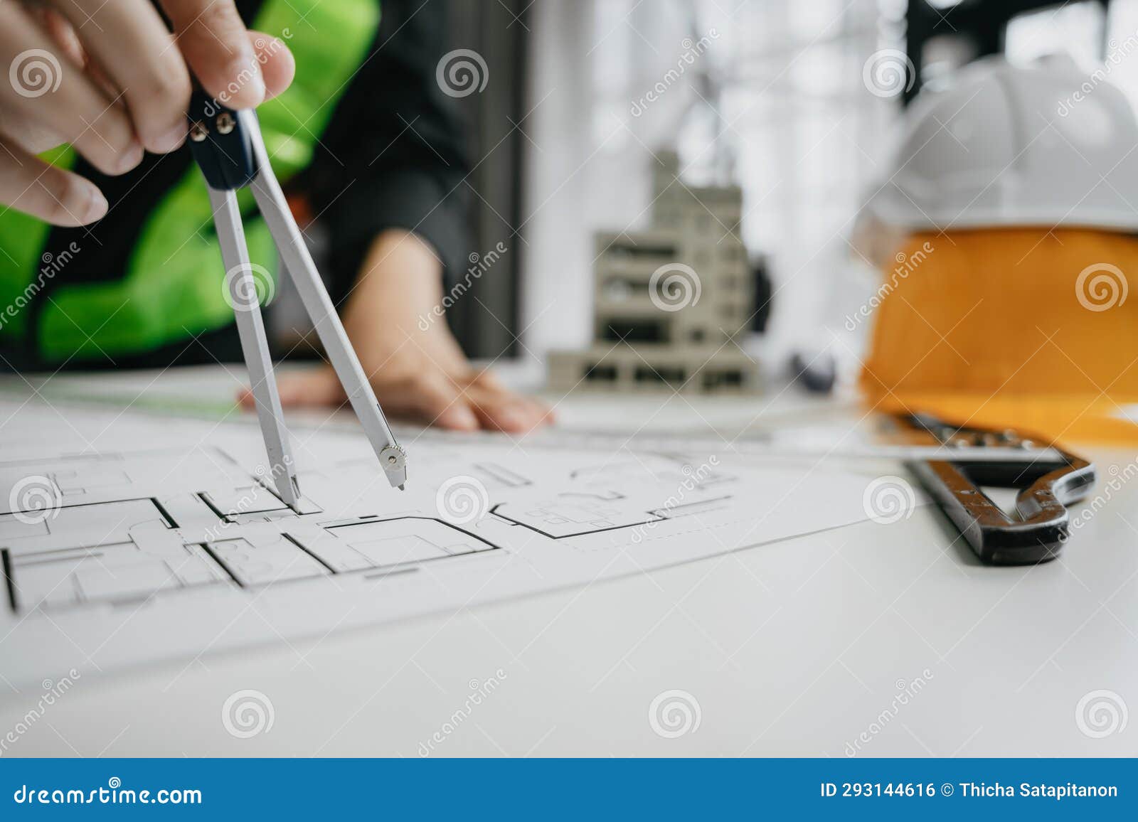 Architect or Engineer Working on Table Use Drawing Tool on the Paper ...