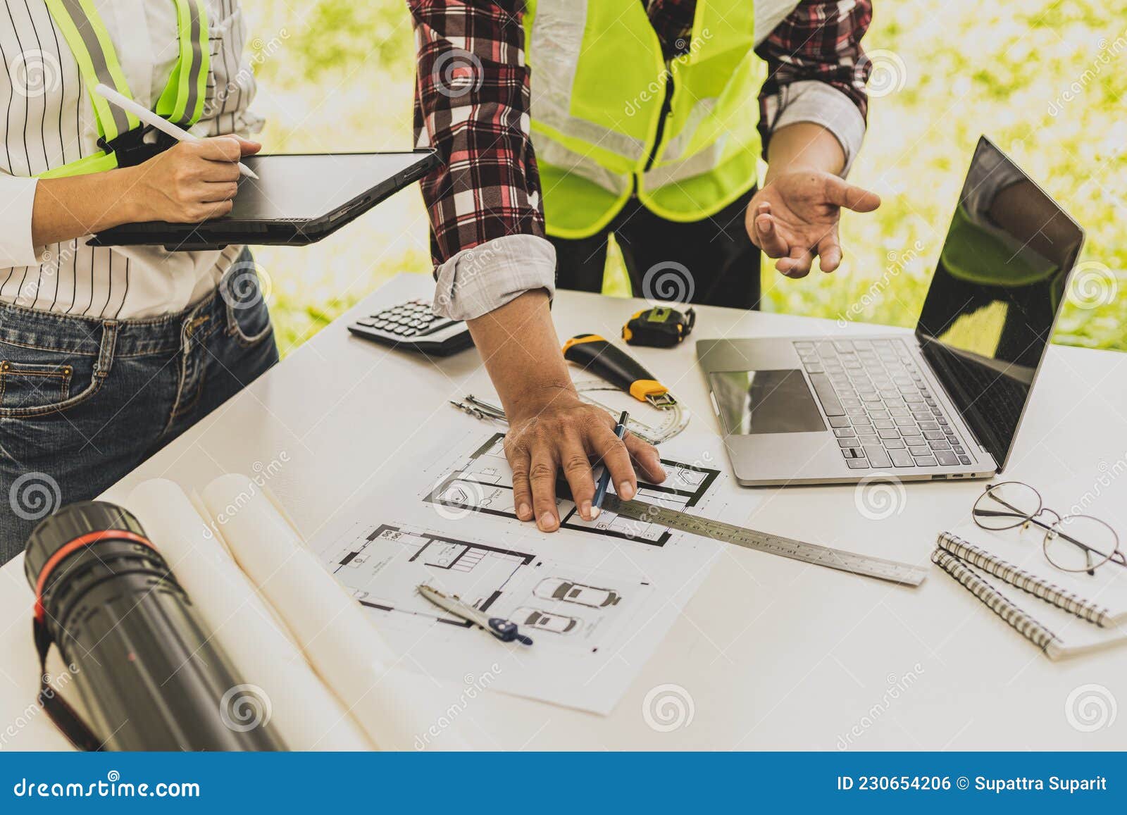 Architect Engineers are Standing by To Look at the Blueprints of the ...