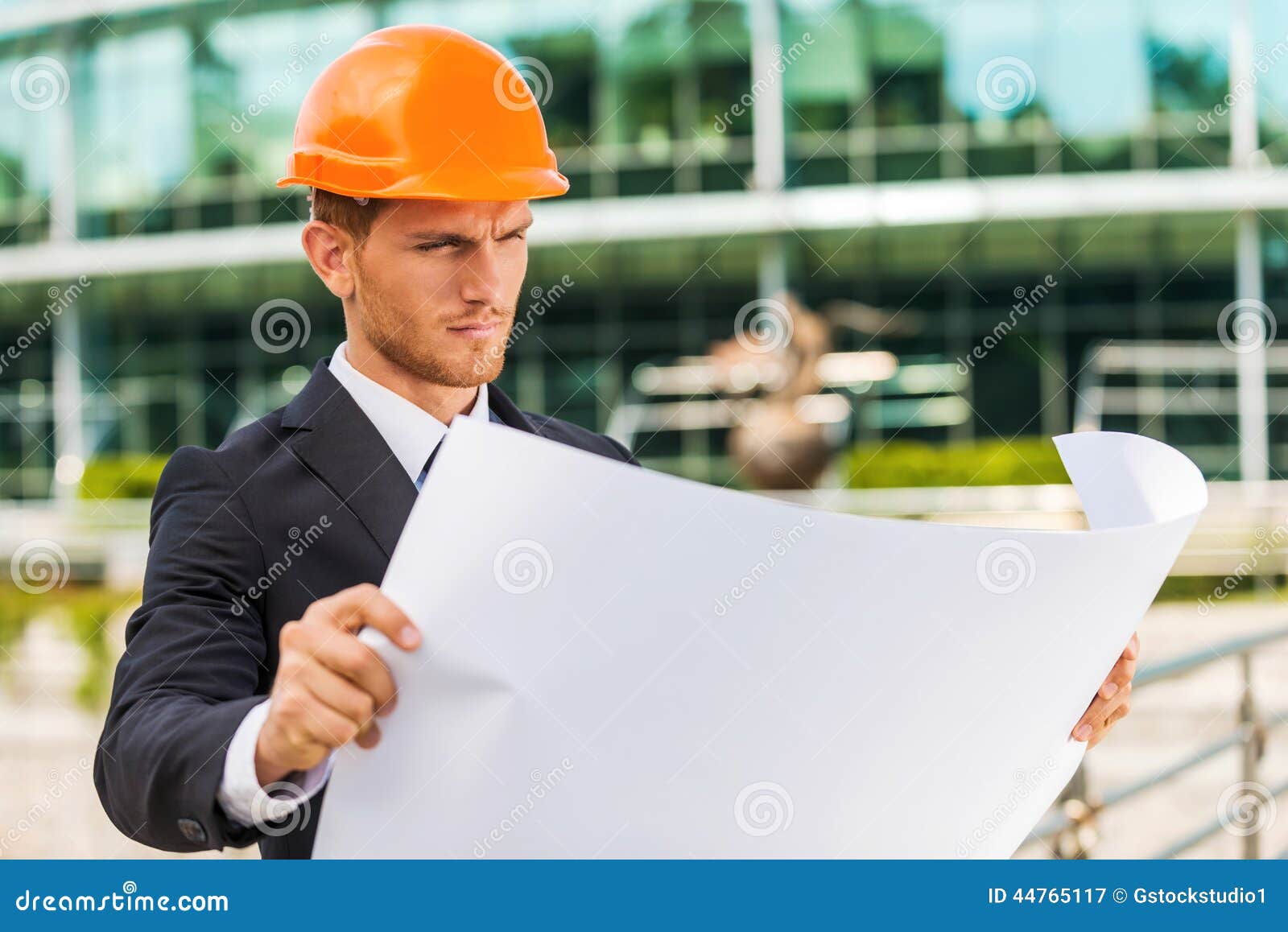 Architect Examining Blueprint. Stock Image - Image of handsome ...