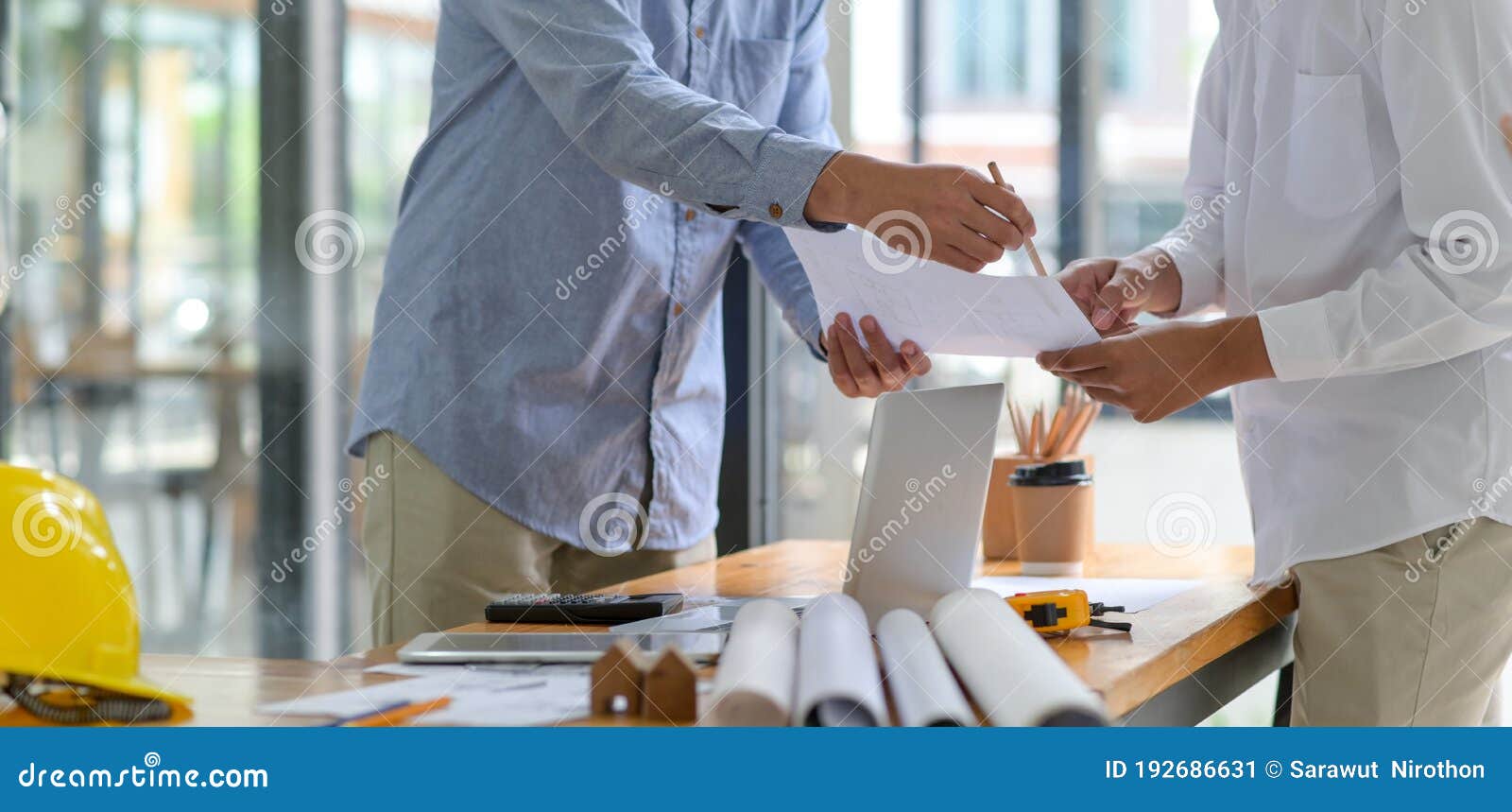 The Architect is Explaining the House Plan To the Contractor Stock ...