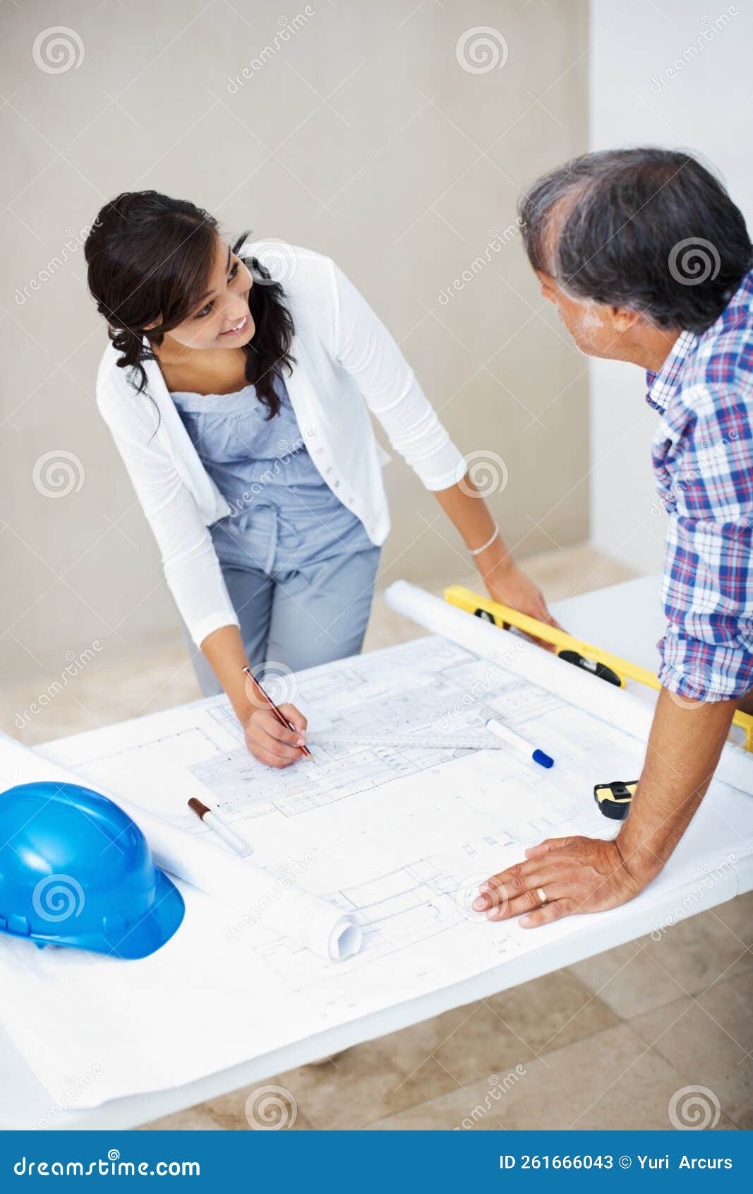 Architect Explaining Plans To Female Client. Mature Architect ...