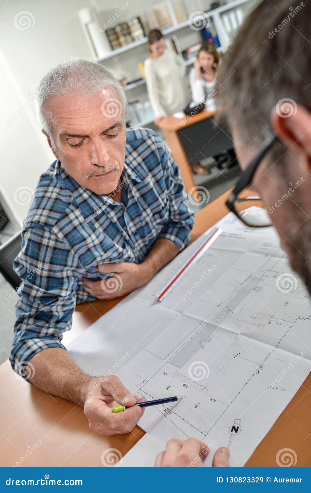 Architect Explaining Something To Client Stock Image - Image of styling ...