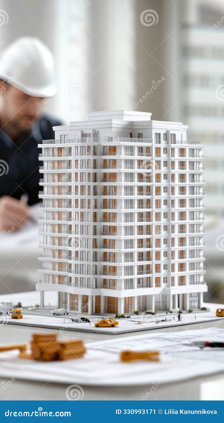 An Architect Focuses on Drawing Details while Working on a Miniature ...