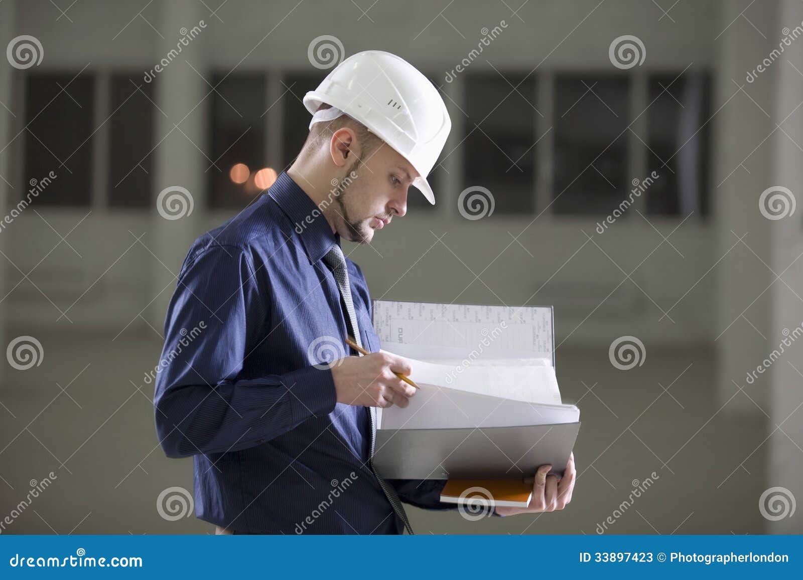 Architect Going through File Folder in Warehouse Stock Image - Image of ...