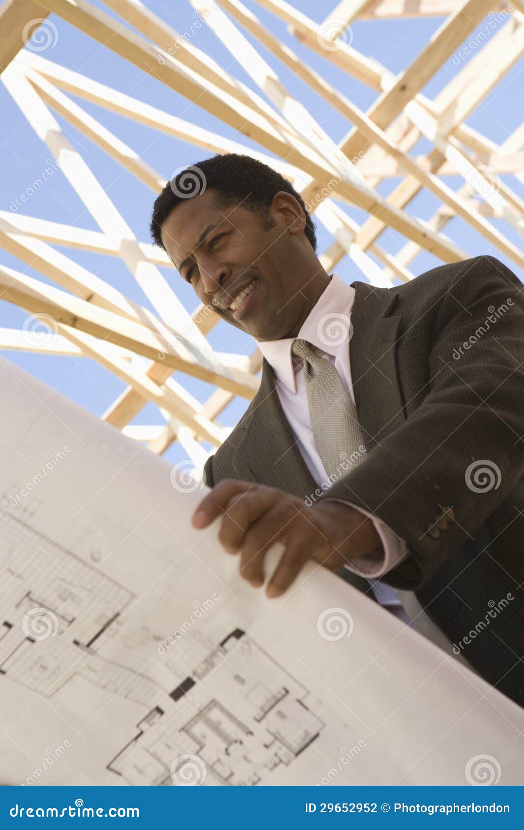 Architect Holding Blueprint Stock Photo - Image of builder, framework ...