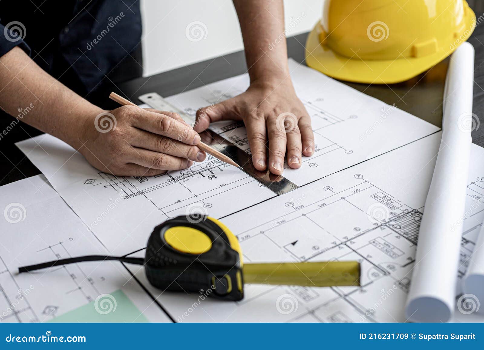 An Architect, a Home Design Engineer, is Drafting a House Plan for a ...