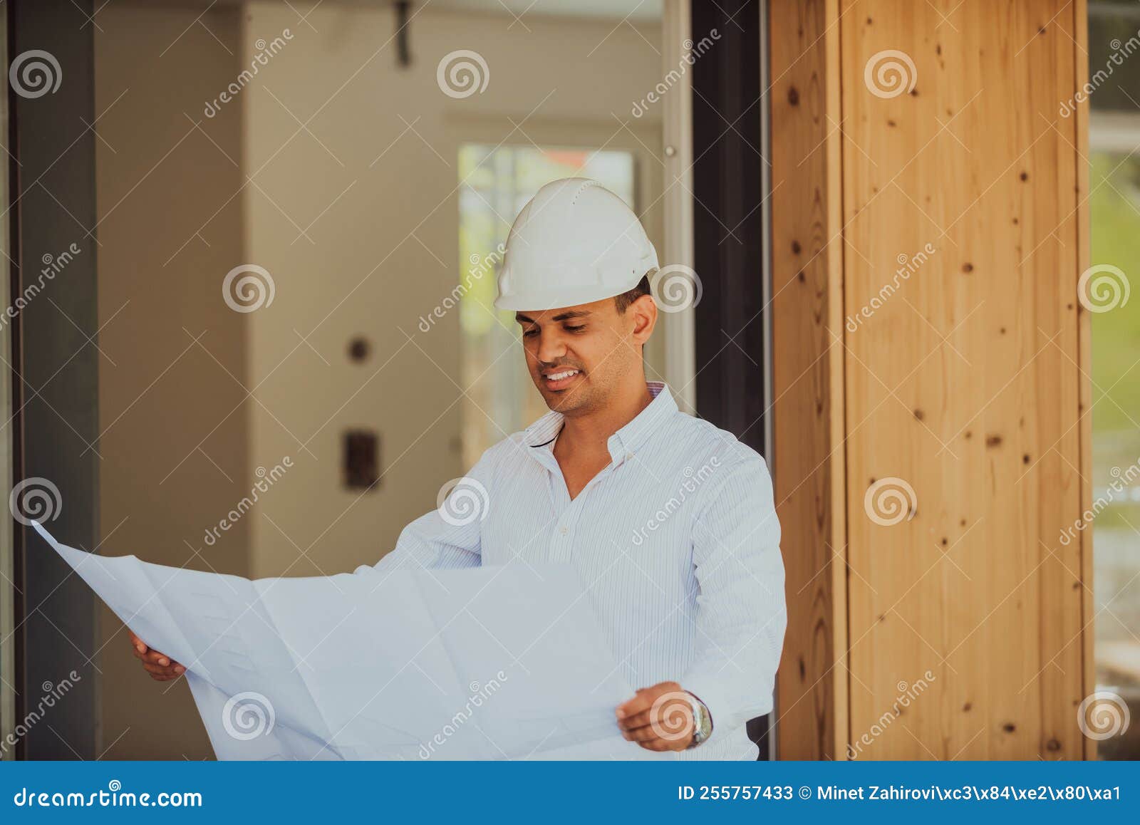 A Architect Looking at Plan and Thinking about Working on Big Project ...