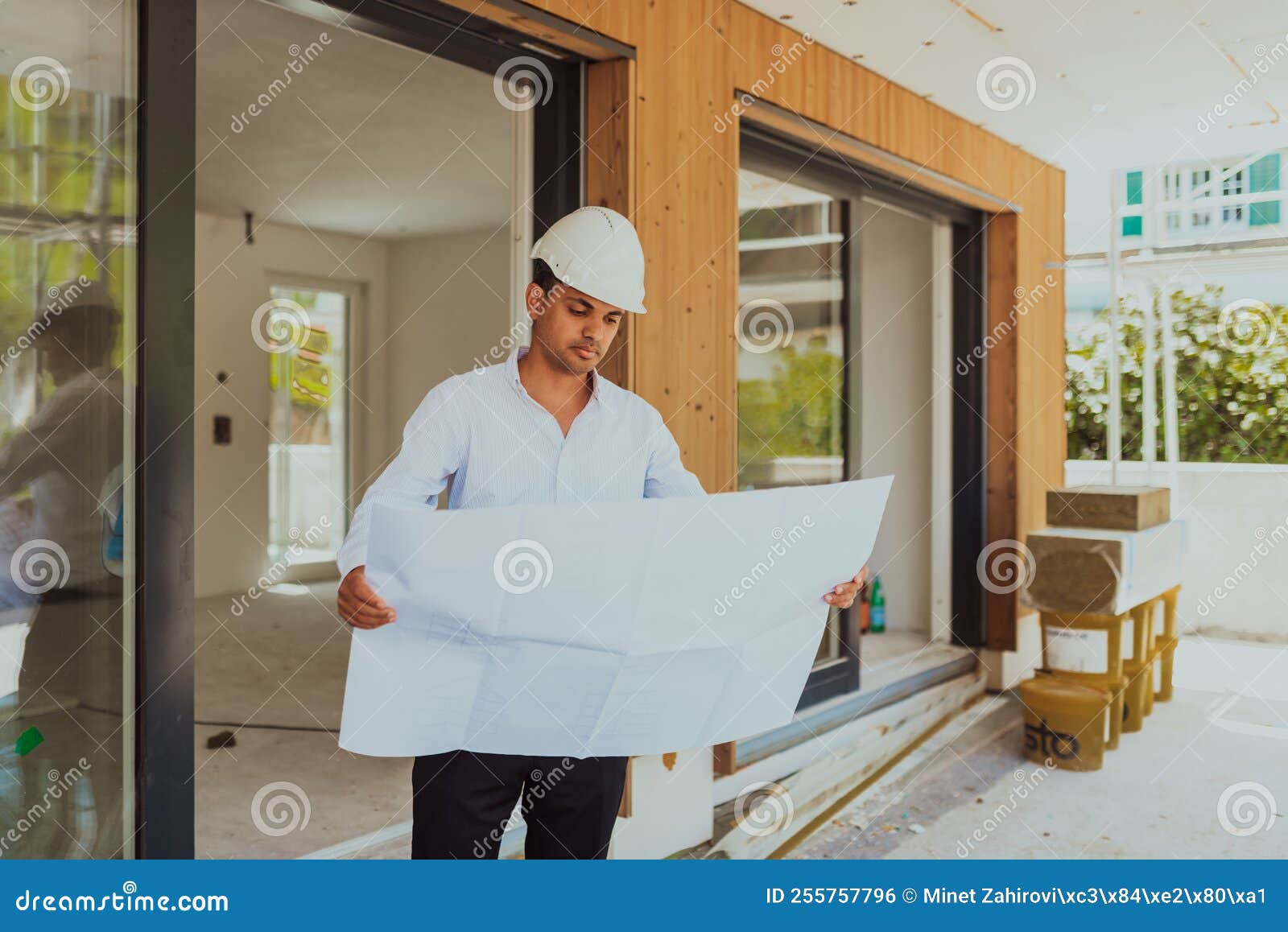 A Architect Looking at Plan and Thinking about Working on Big Project ...