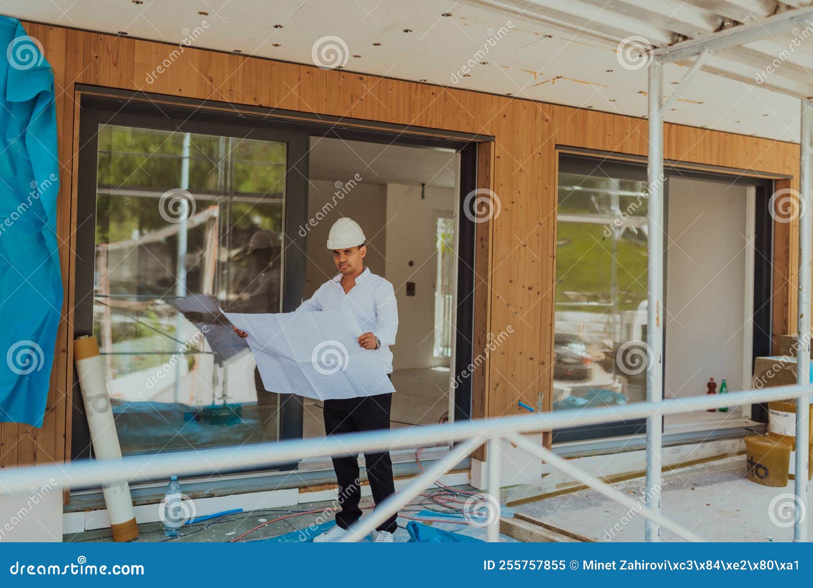 A Architect Looking at Plan and Thinking about Working on Big Project ...