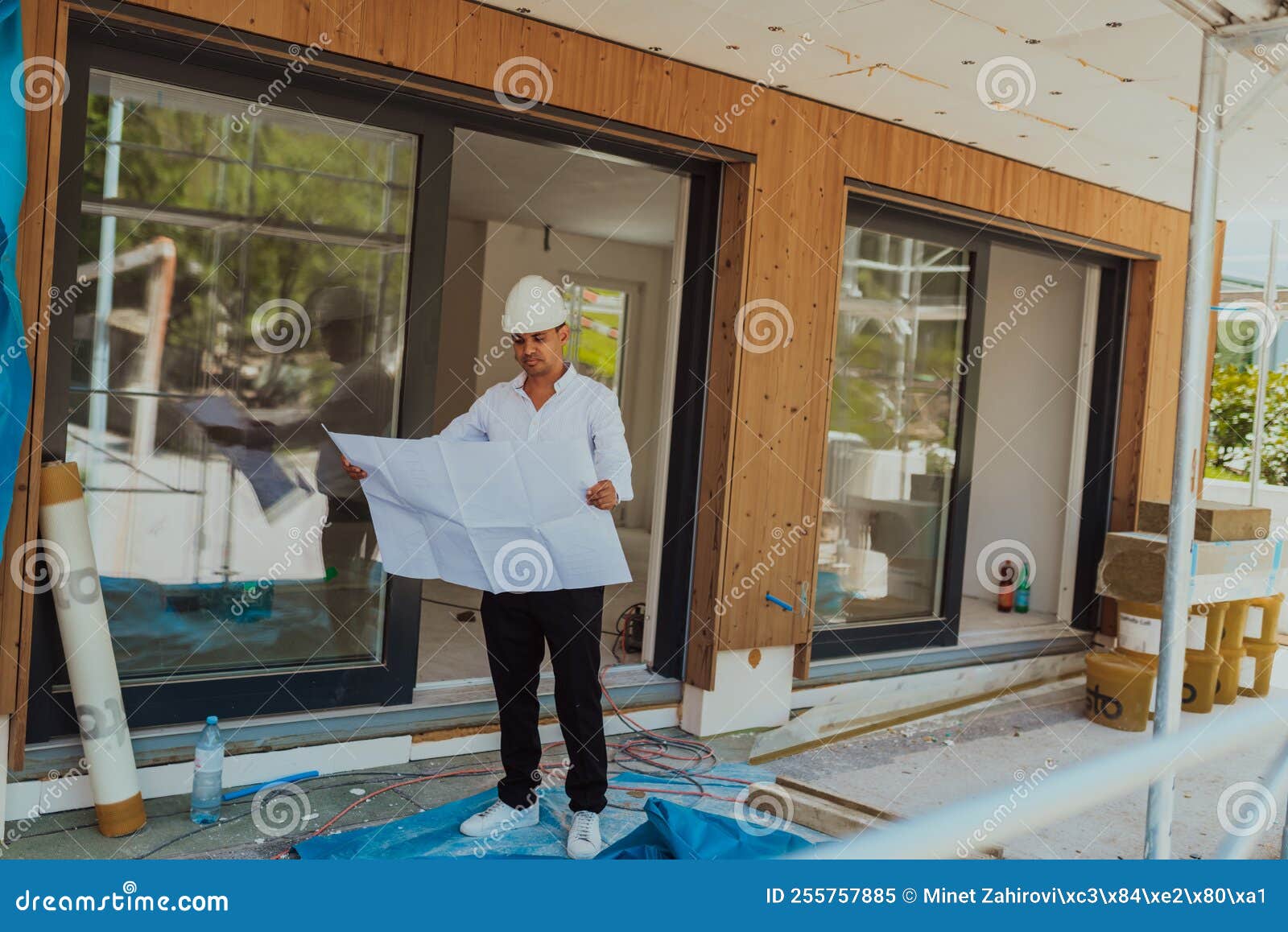 A Architect Looking at Plan and Thinking about Working on Big Project ...