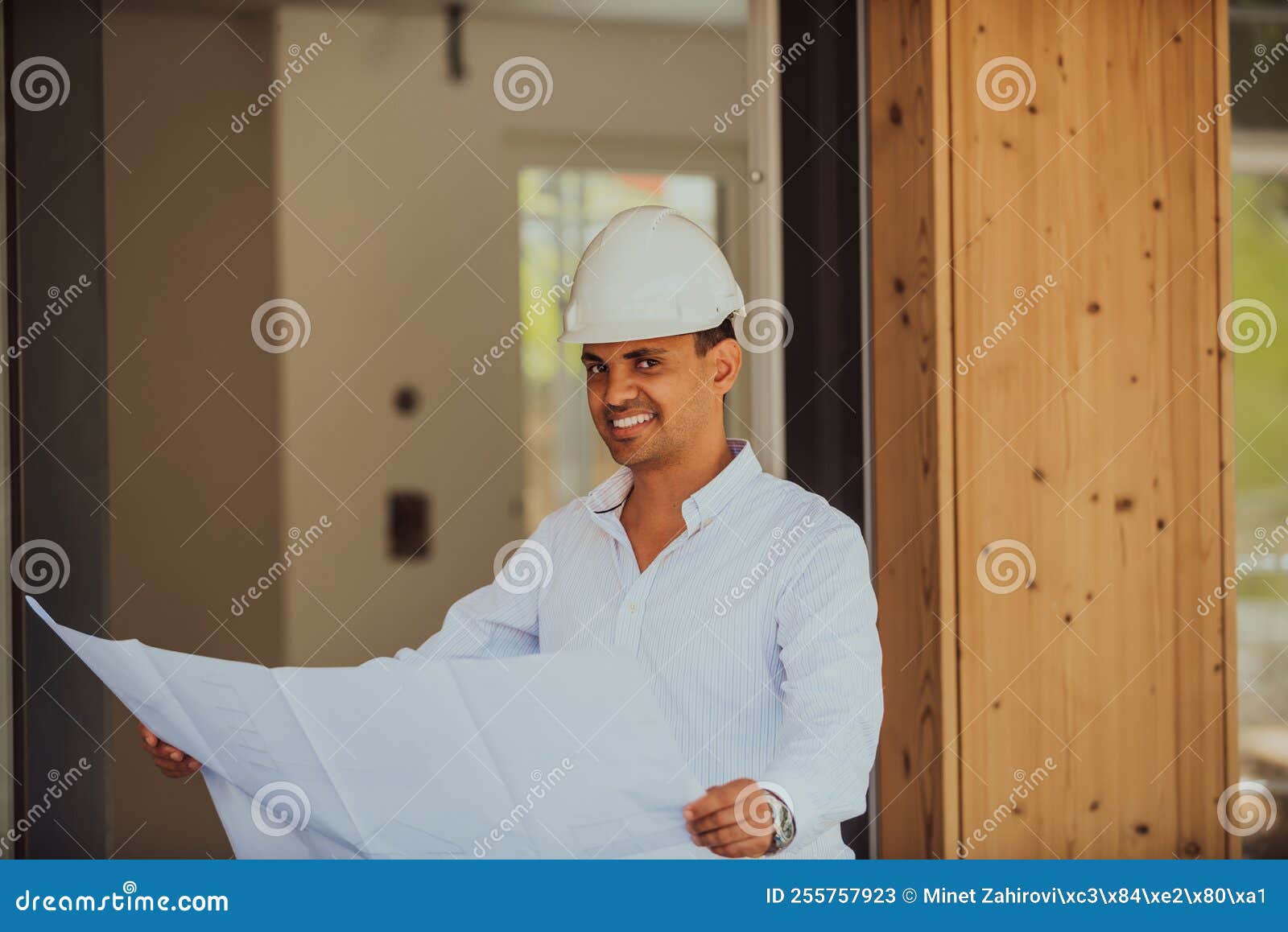 A Architect Looking at Plan and Thinking about Working on Big Project ...