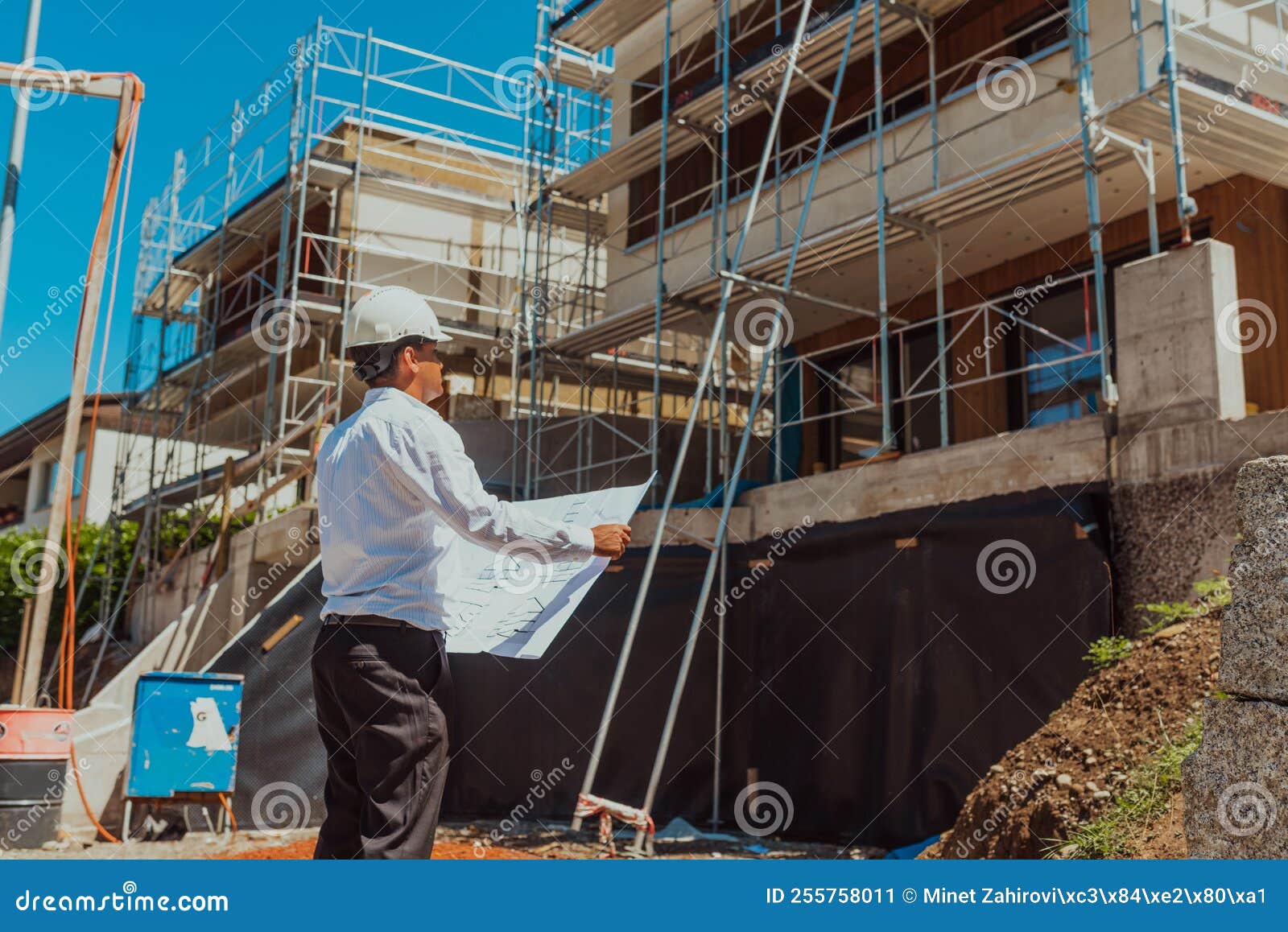 A Architect Looking at Plan and Thinking about Working on Big Project ...