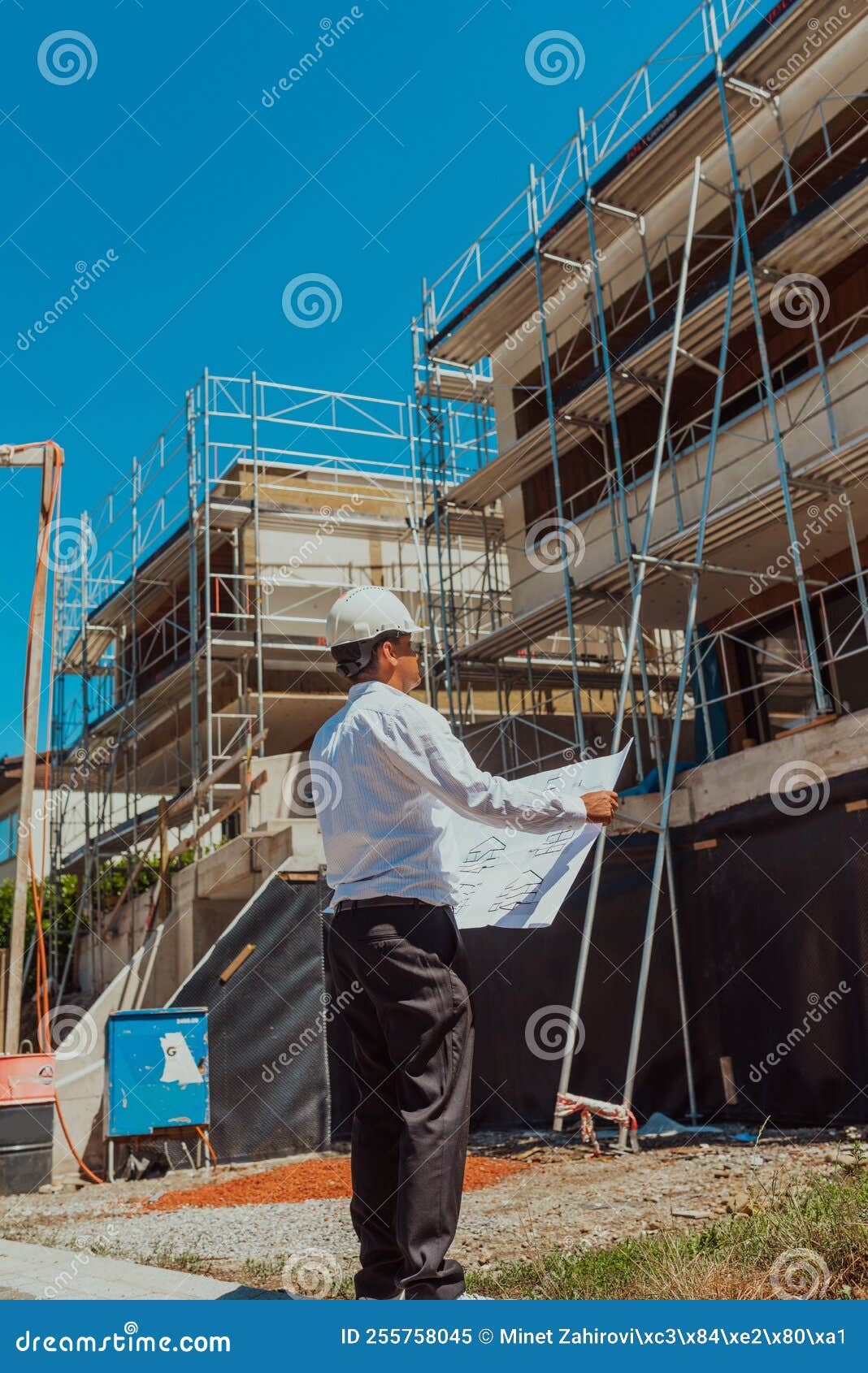 A Architect Looking at Plan and Thinking about Working on Big Project ...