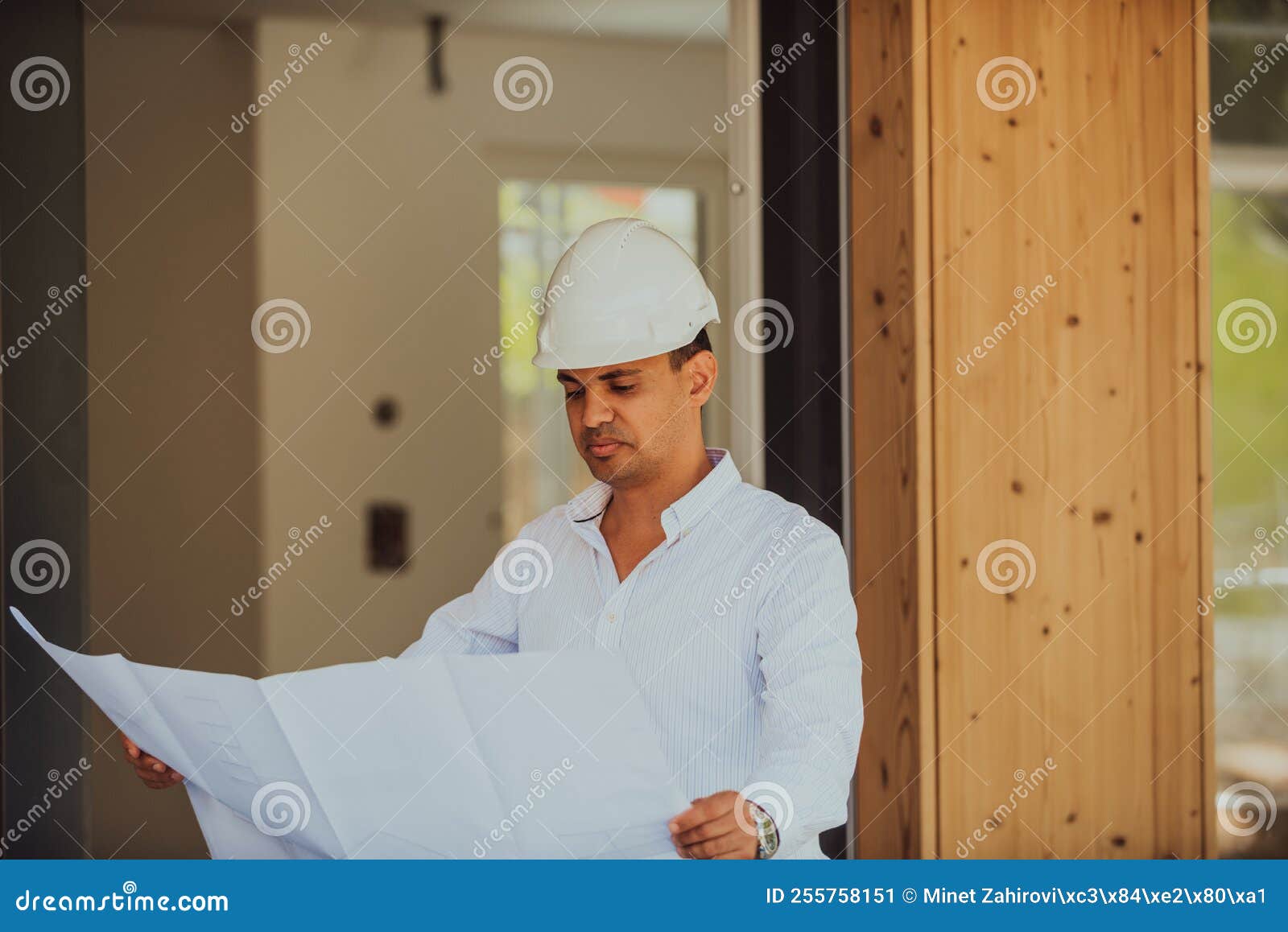 A Architect Looking at Plan and Thinking about Working on Big Project ...