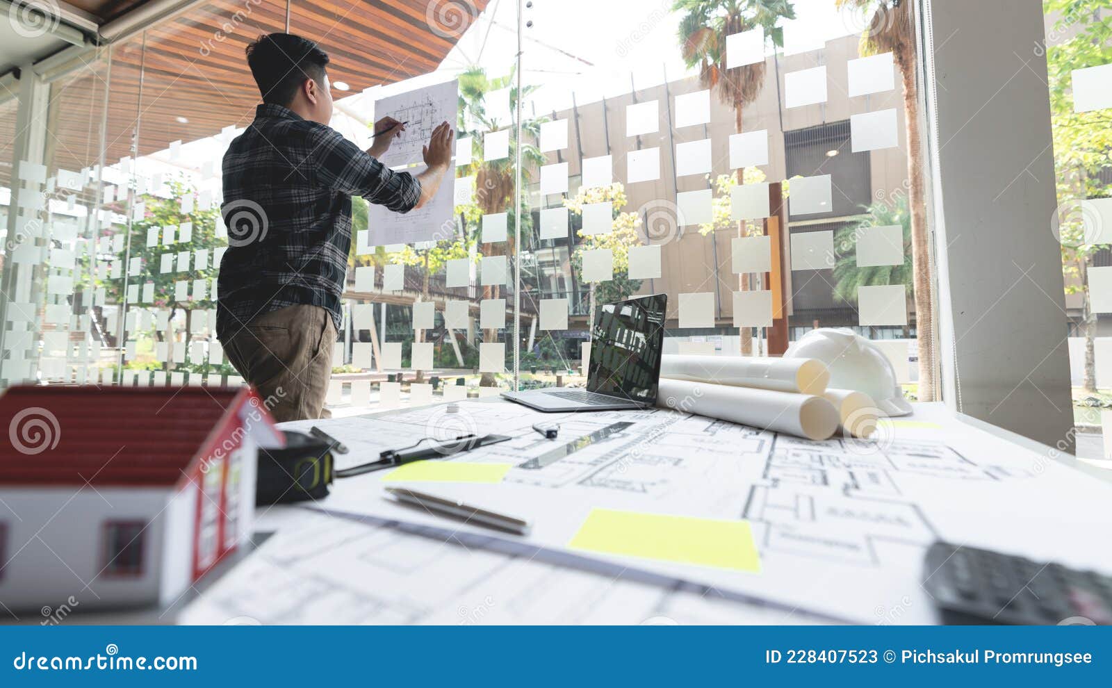 An Architect Looking the Whole Schematic Blueprint Revising the Details ...
