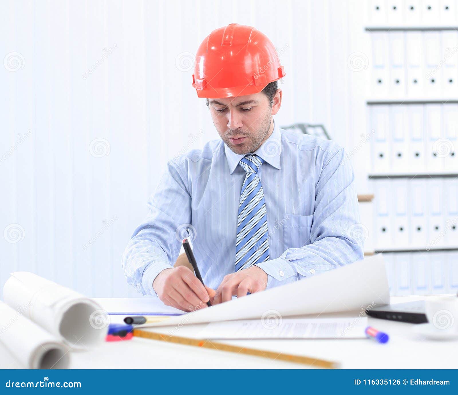 Architect Looking Working in Office at Desk. Stock Photo - Image of ...
