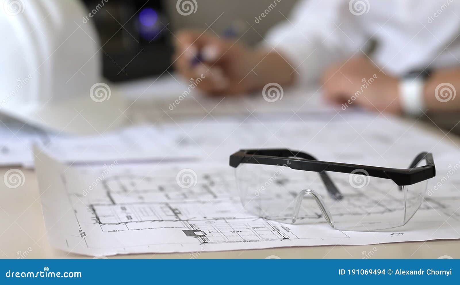 Architect Making Marks on Construction Drawings while Sitting in Office ...
