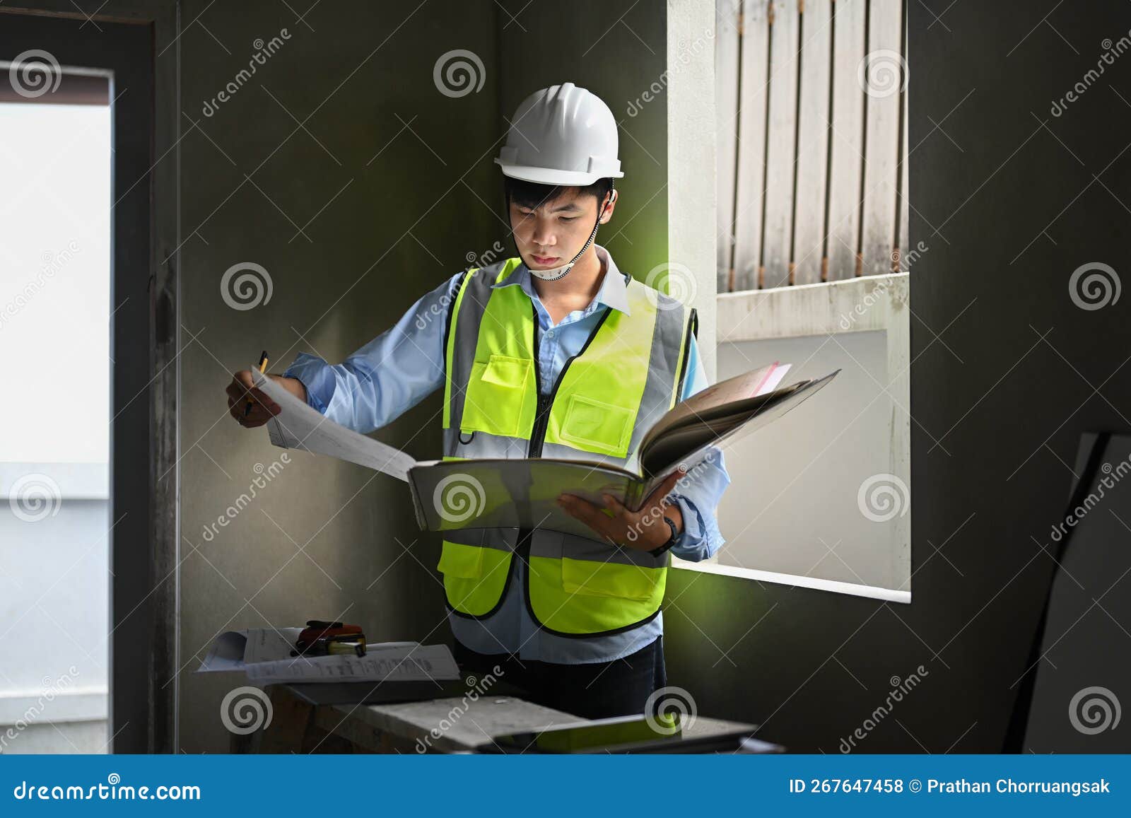 Architect Man in Reflective Jackets Working with Blueprint, Inspecting ...