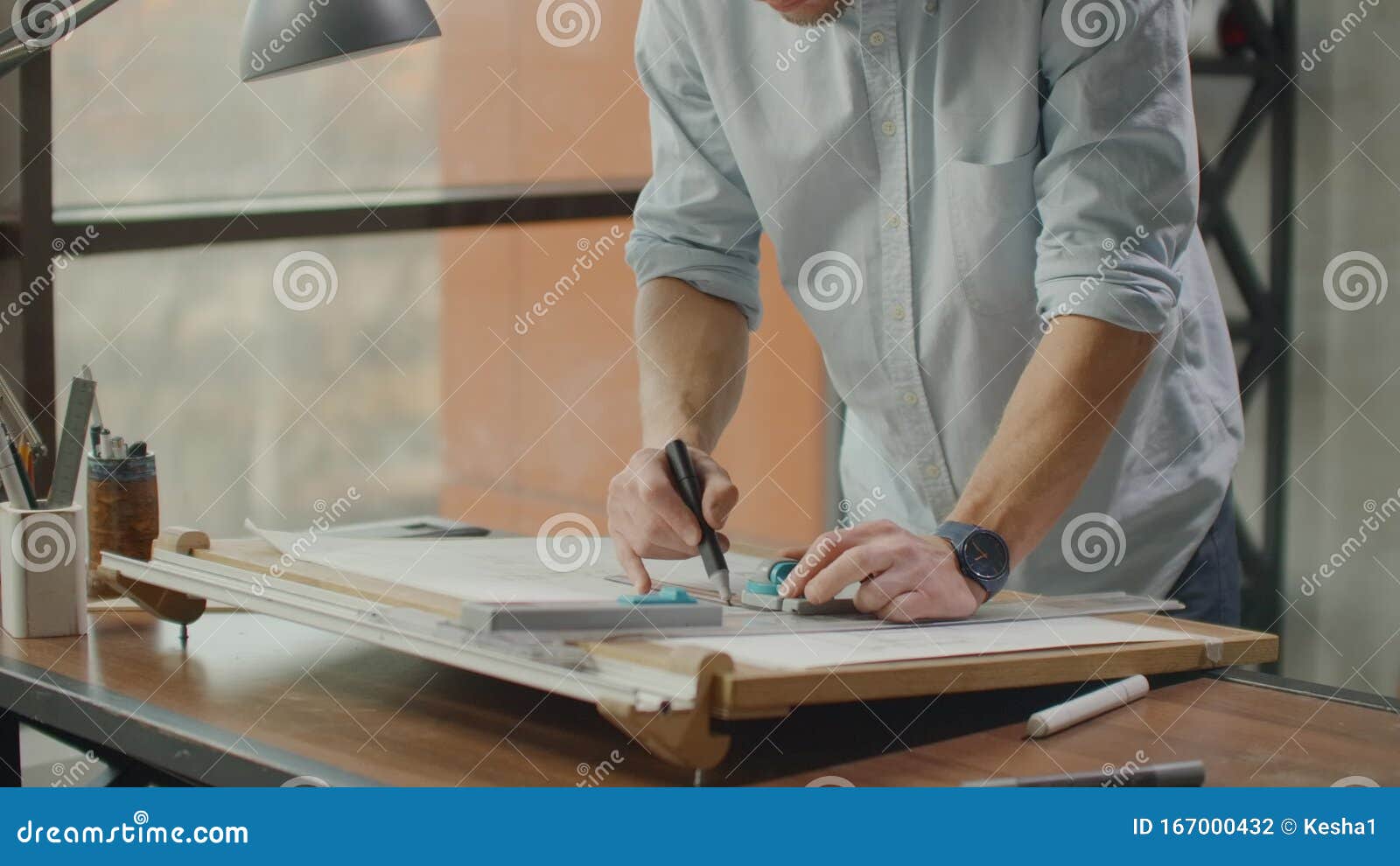 Architect Man Sits at Drafting Table in Modern Industrial Office during ...