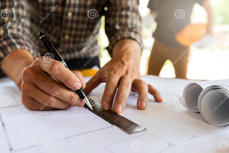 Architect Measuring Scale on Blueprint in Construction Site Stock Photo ...