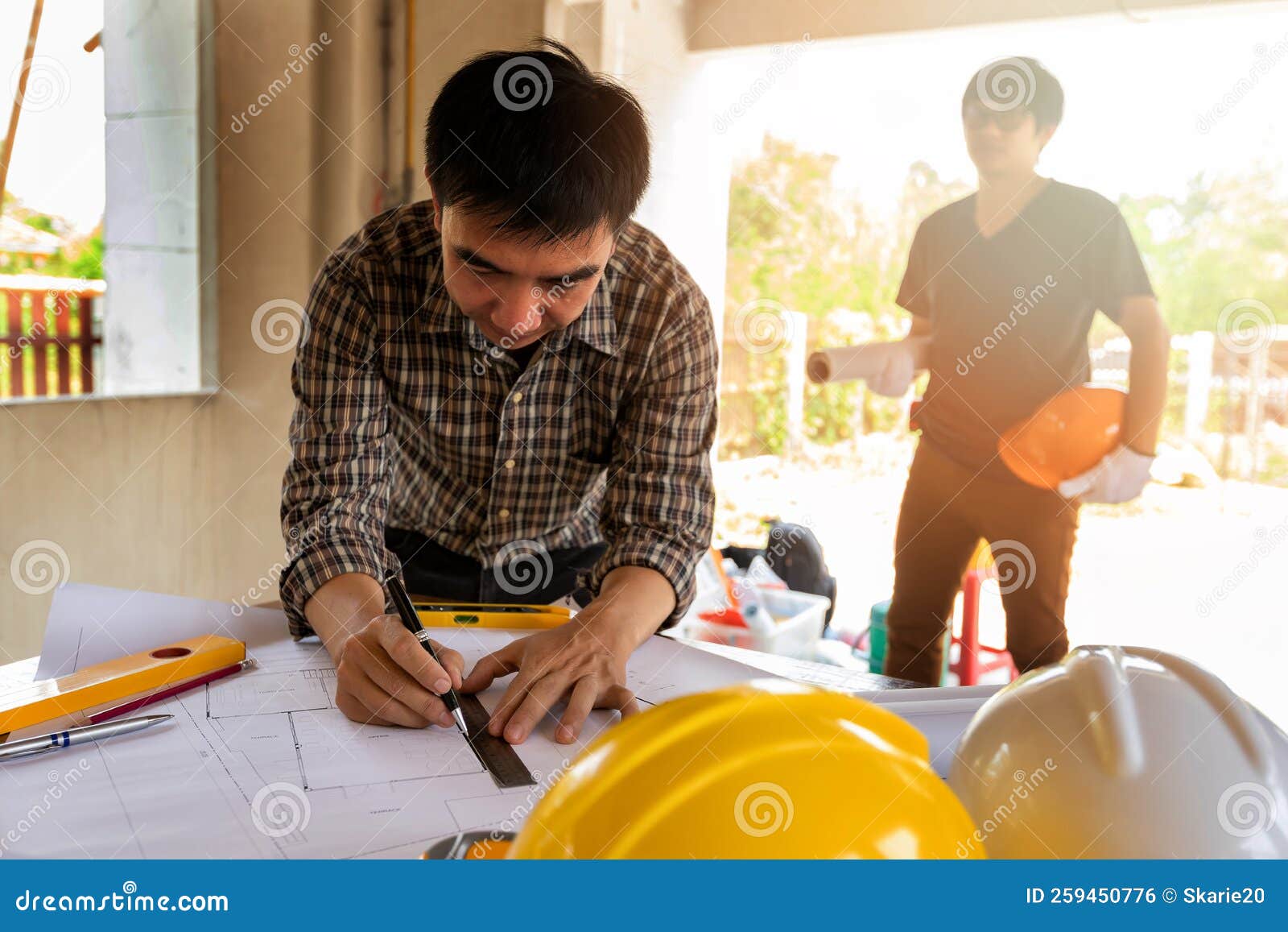 Architect Measuring Scale on Blueprint in Construction Site Stock Photo ...