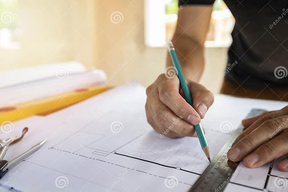 Architect Measuring Scale on Blueprint in Construction Site Stock Photo ...