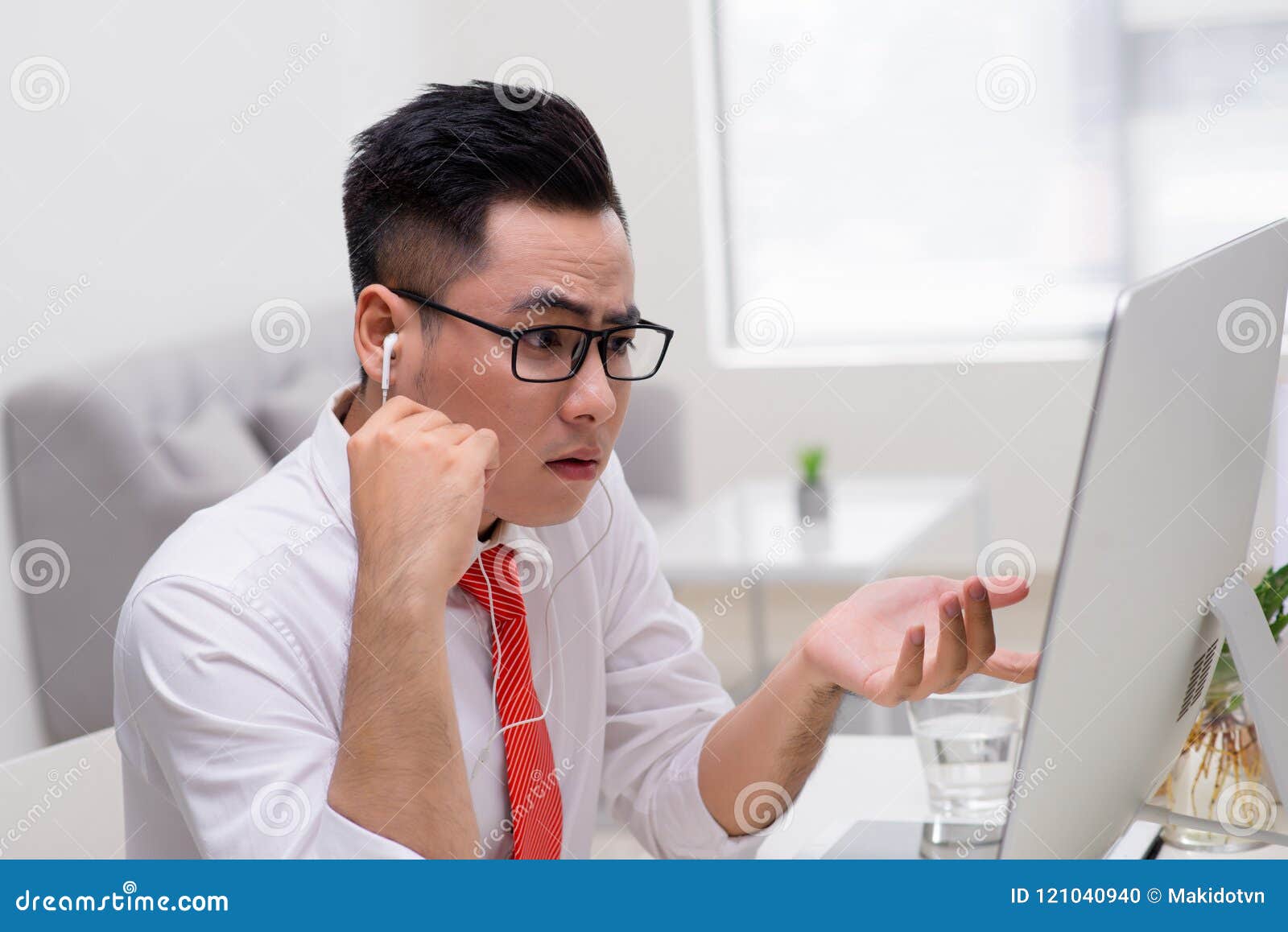 Architect in Office Talking To Client on Phone with Earphones Stock ...