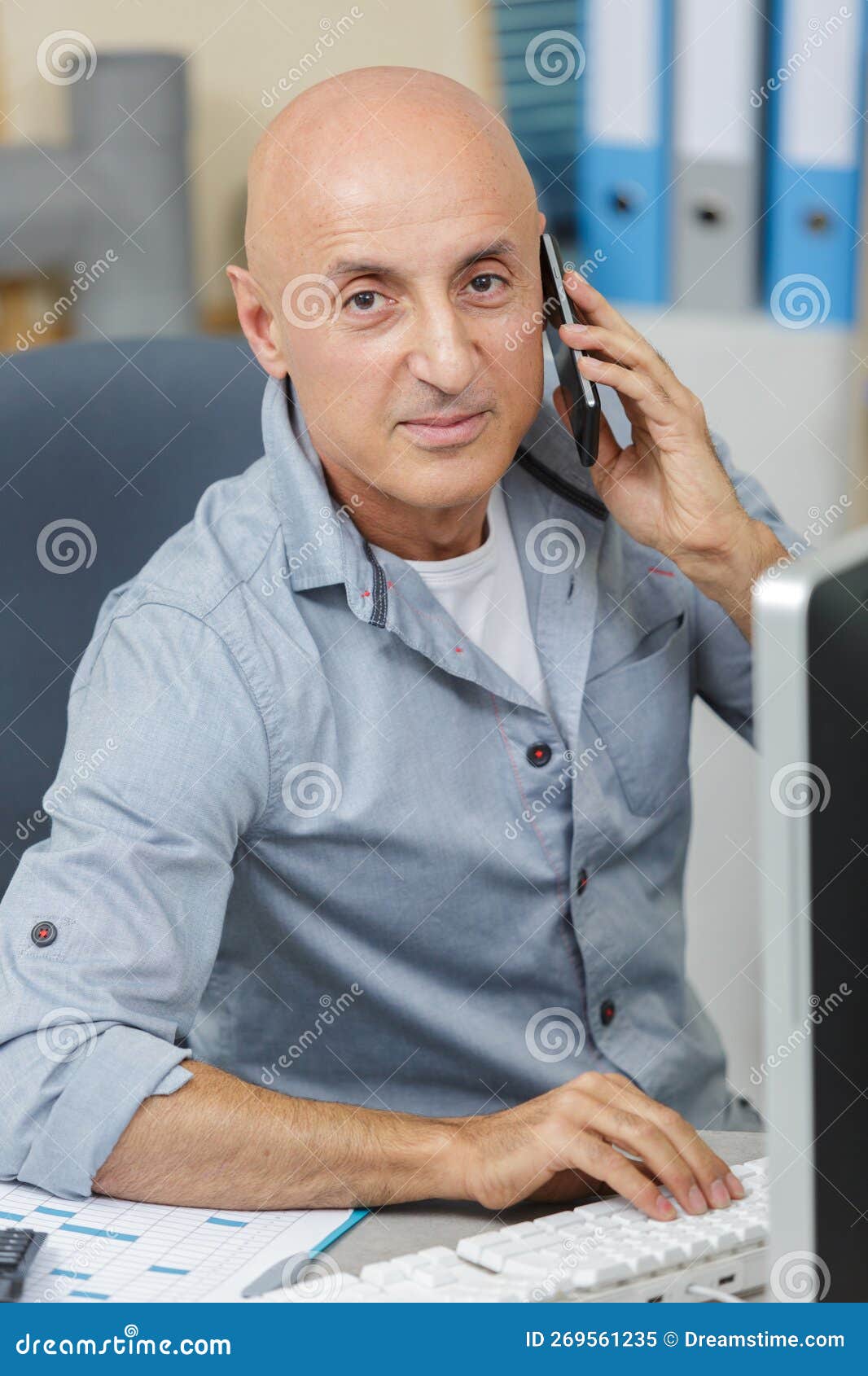 Architect in Office Talking To Client with Smartphone Stock Image ...