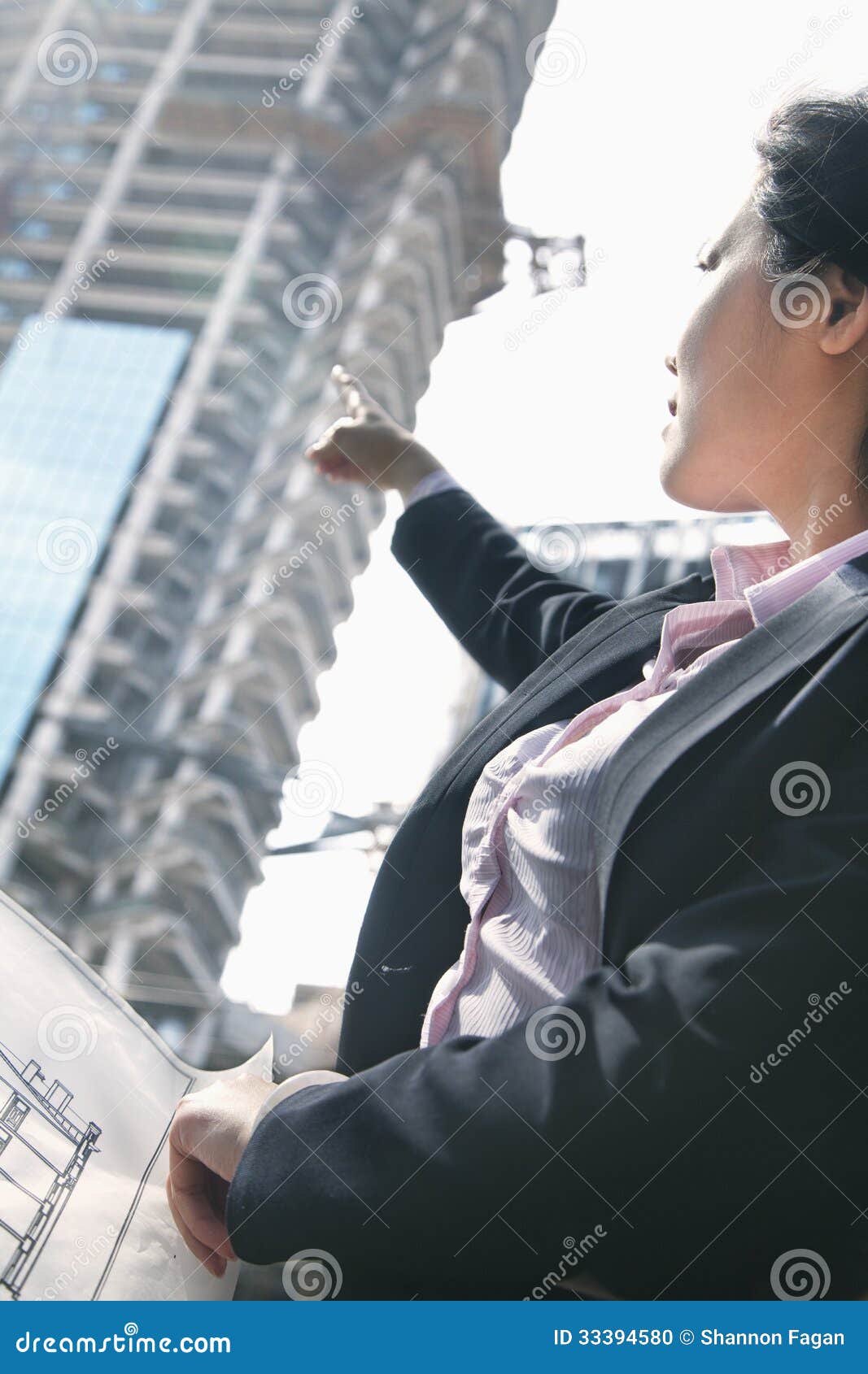 Architect Pointing at Building at a Construction Site Stock Photo ...